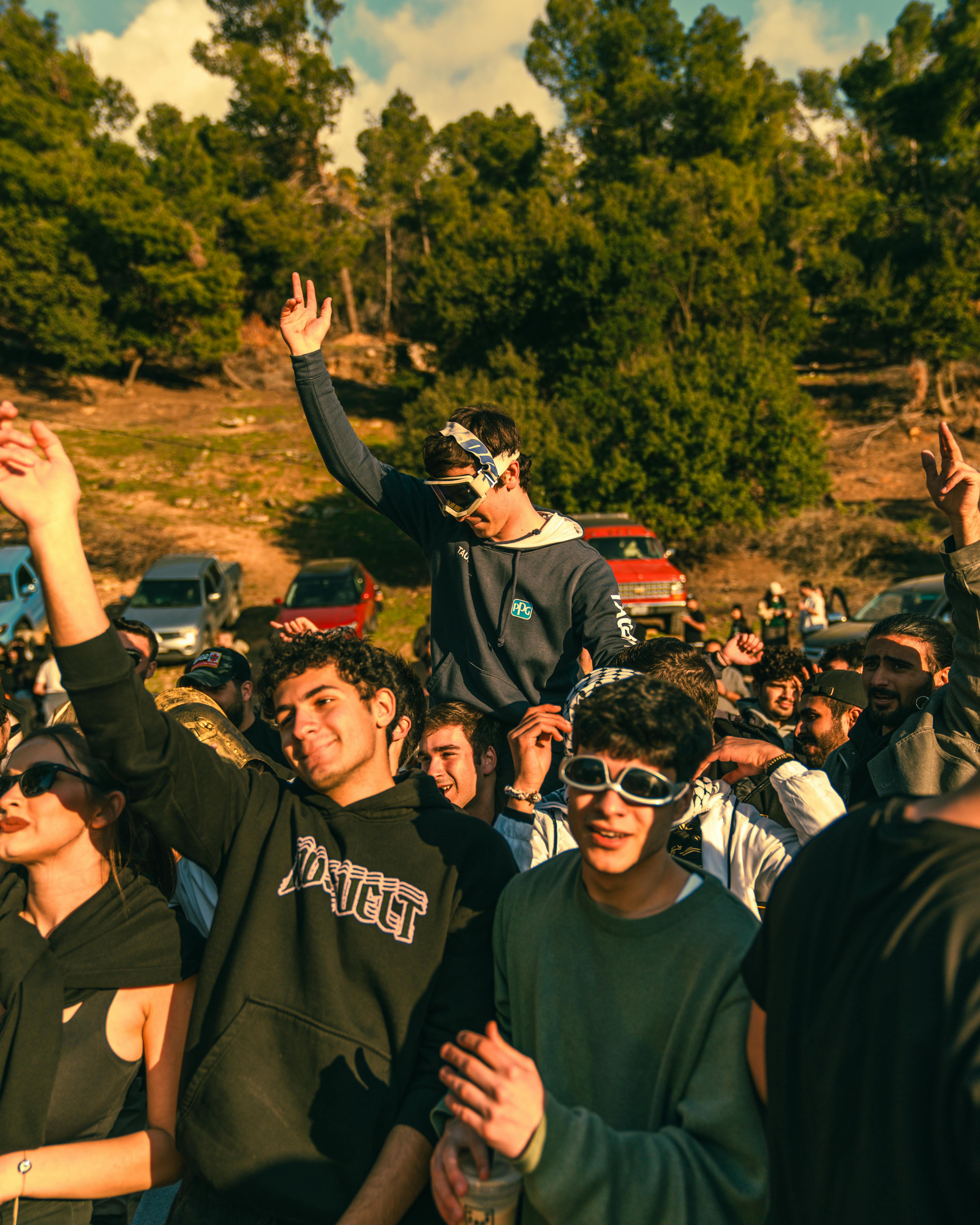 A Group of Men Dancing Outside · Free Stock Photo