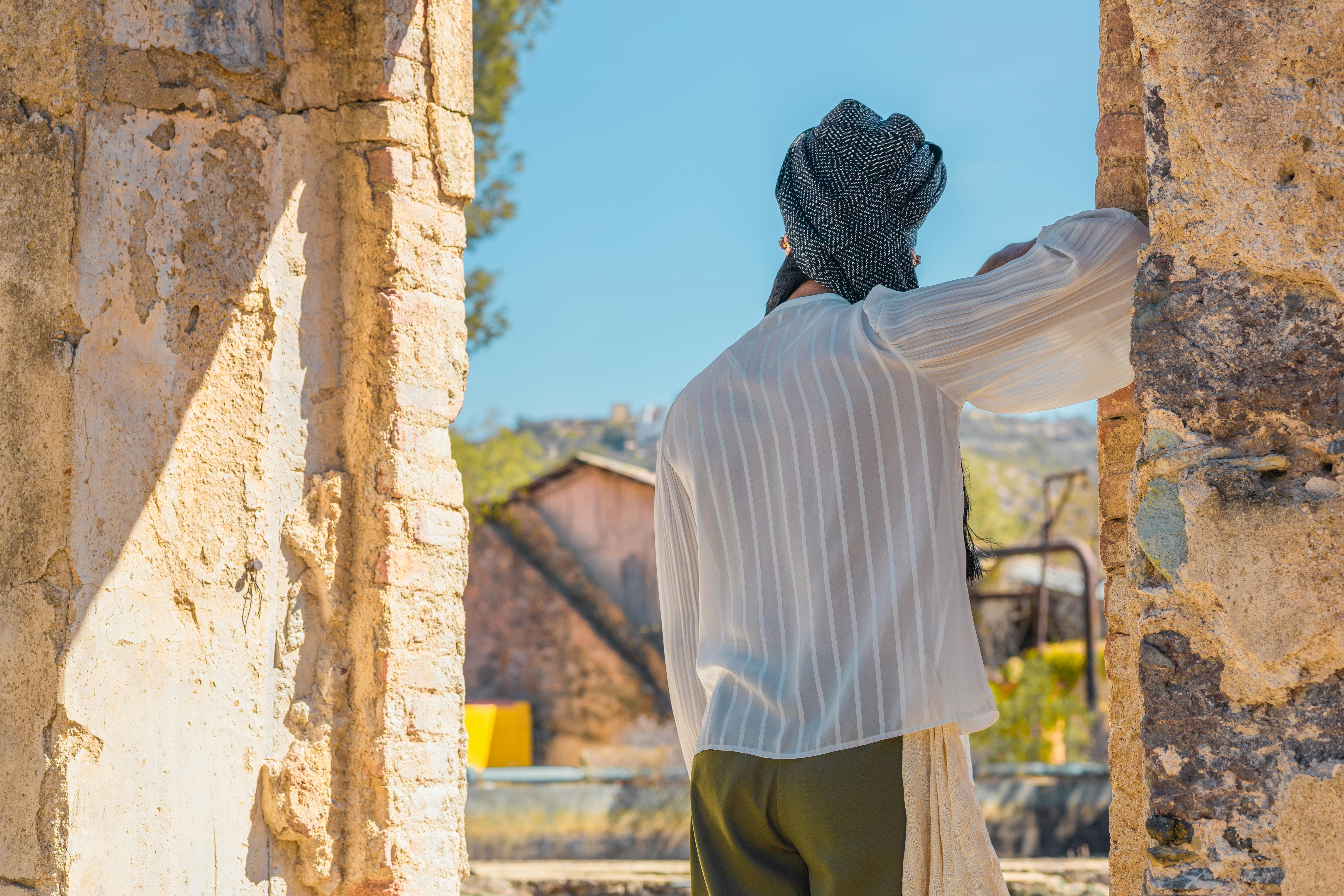 Back View of a Woman Wearing a Headscarf · Free Stock Photo
