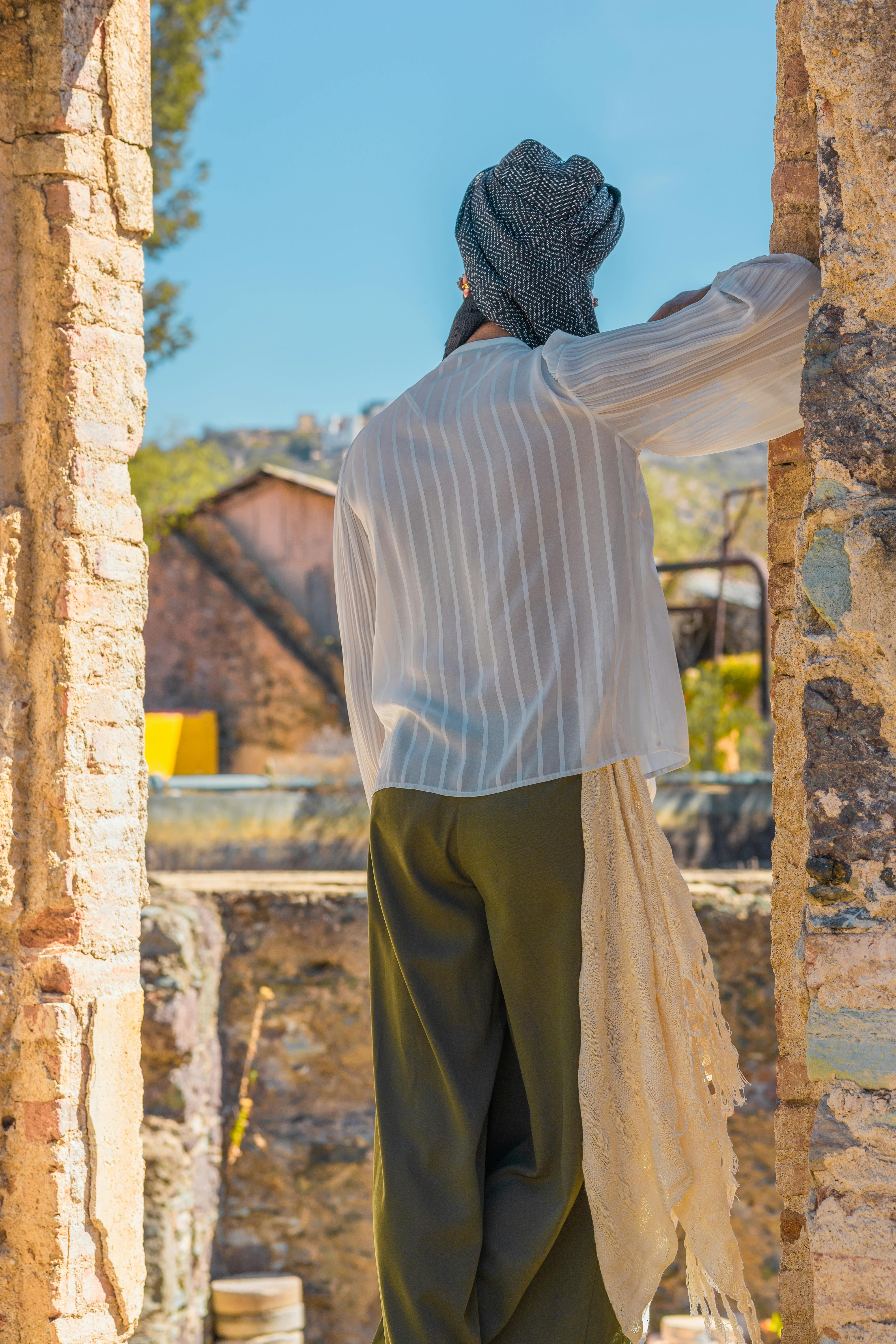 Back View of a Man Wearing a Shirt and a Headscarf · Free Stock Photo