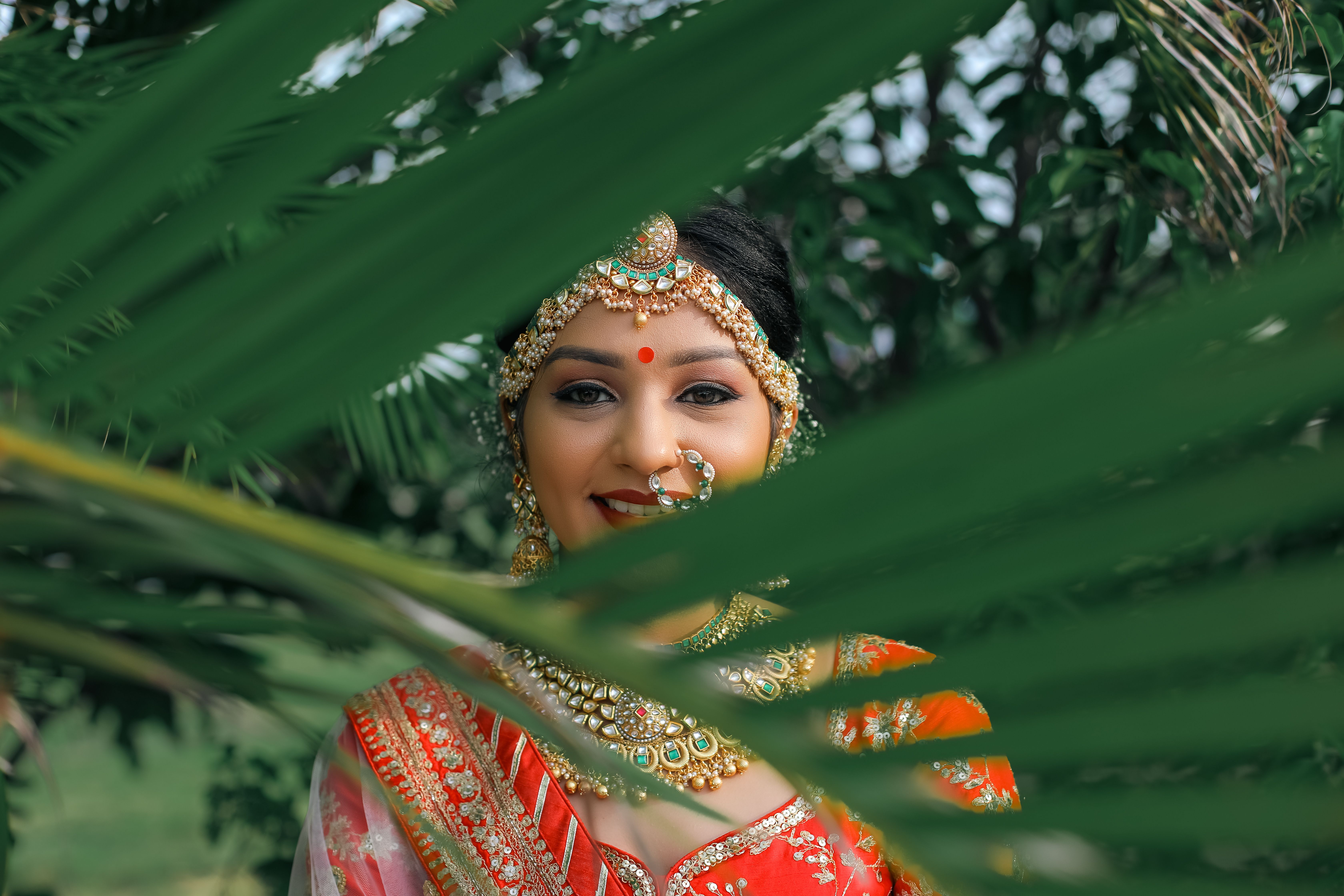 A beautiful indian bride in a traditional red and gold outfit · Free ...
