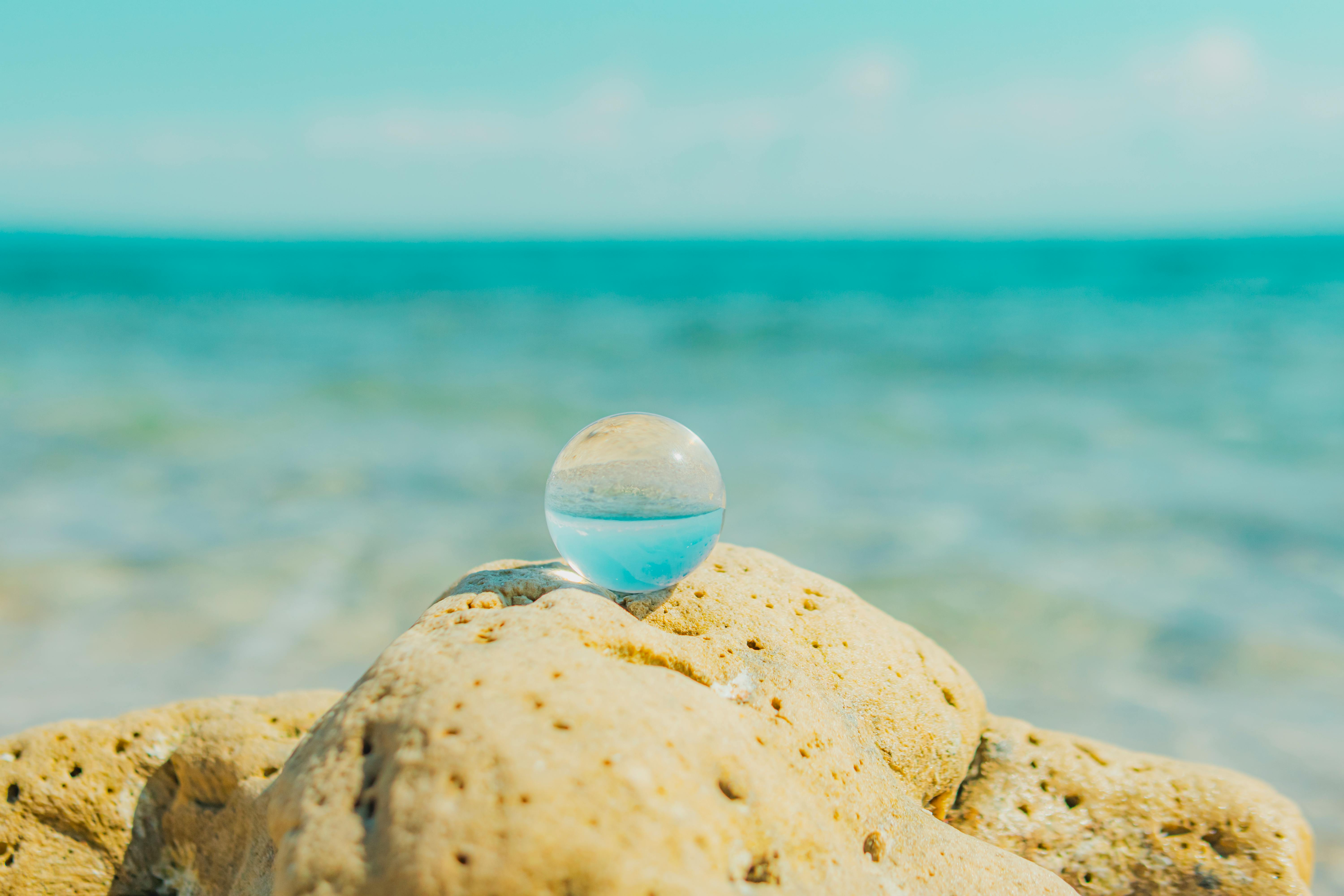 Clear Ball on Gray Rock · Free Stock Photo