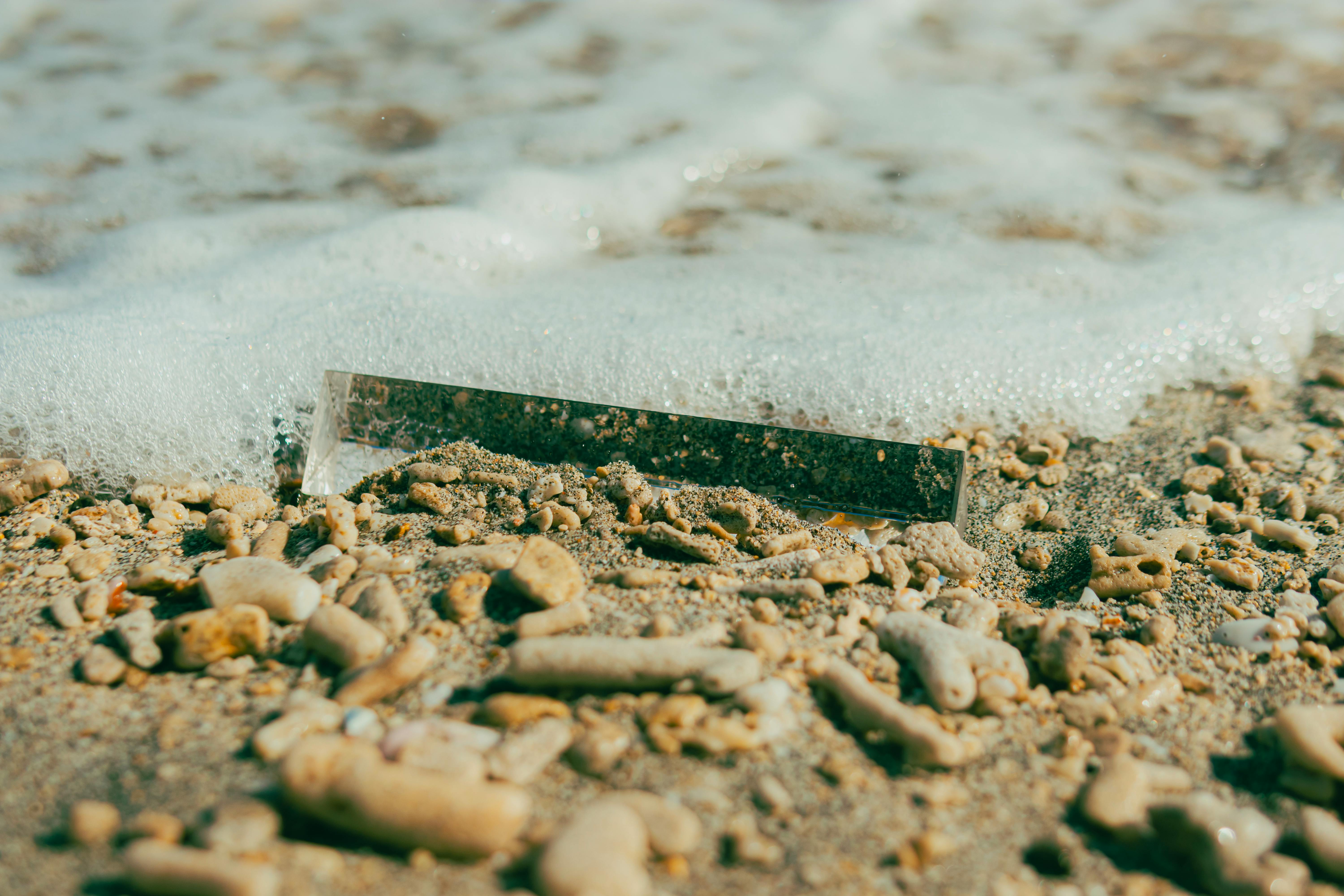 Close-up of a Foamy Wave Washing Up the Beach · Free Stock Photo