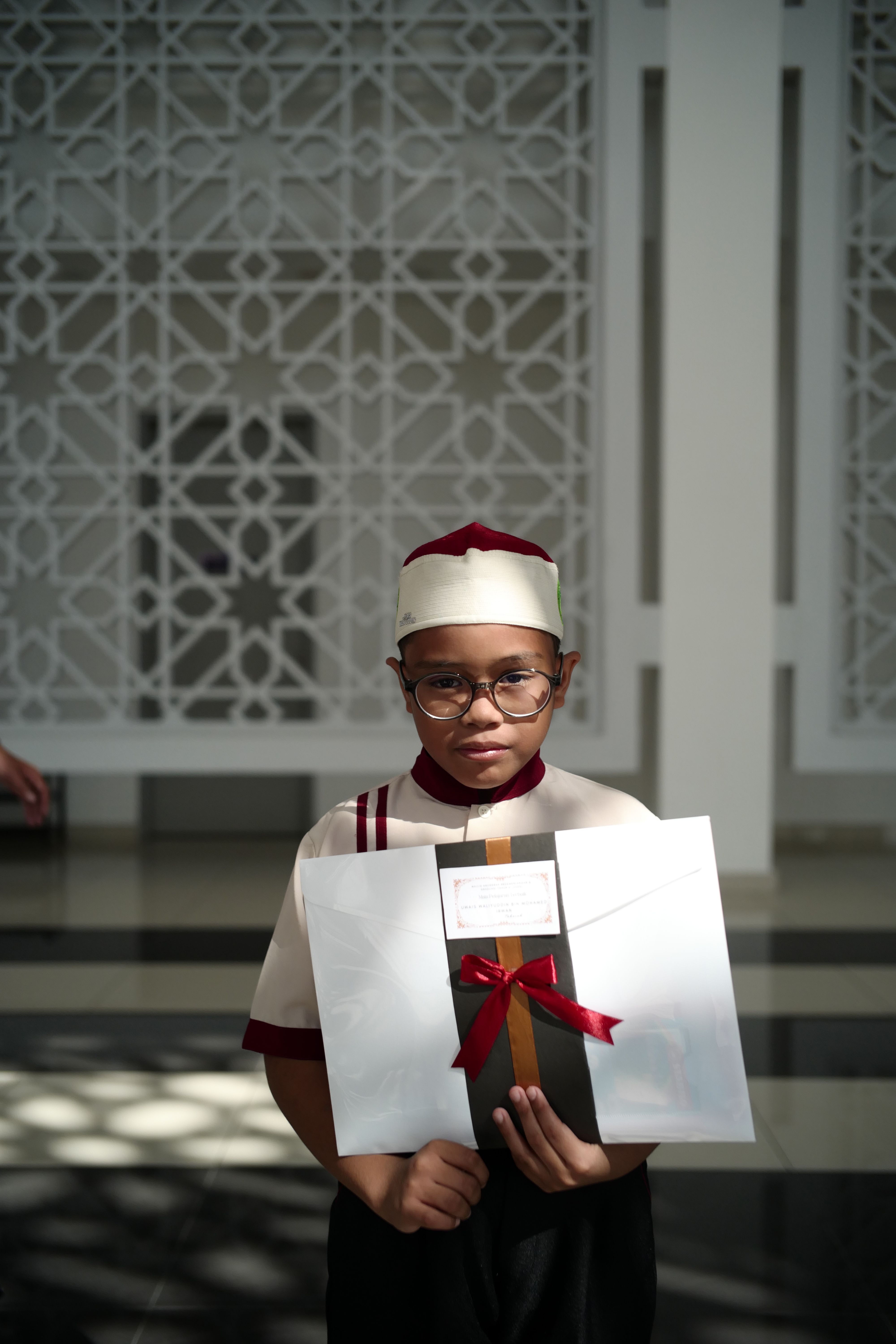 A Boy in a Traditional Cap Holding an Envelope with a Ribbon · Free ...
