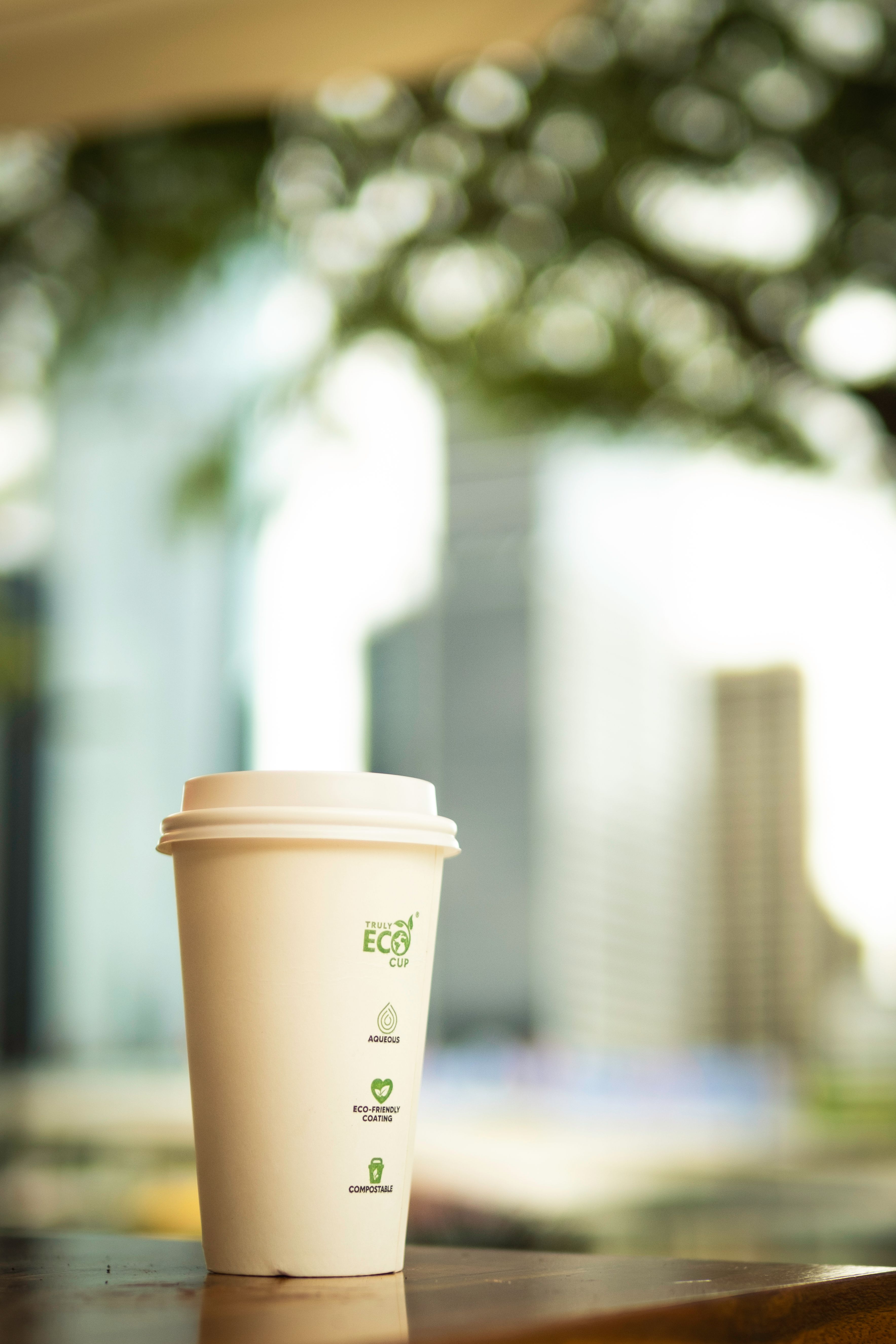 Paper Takeout Coffee Cup on Table · Free Stock Photo