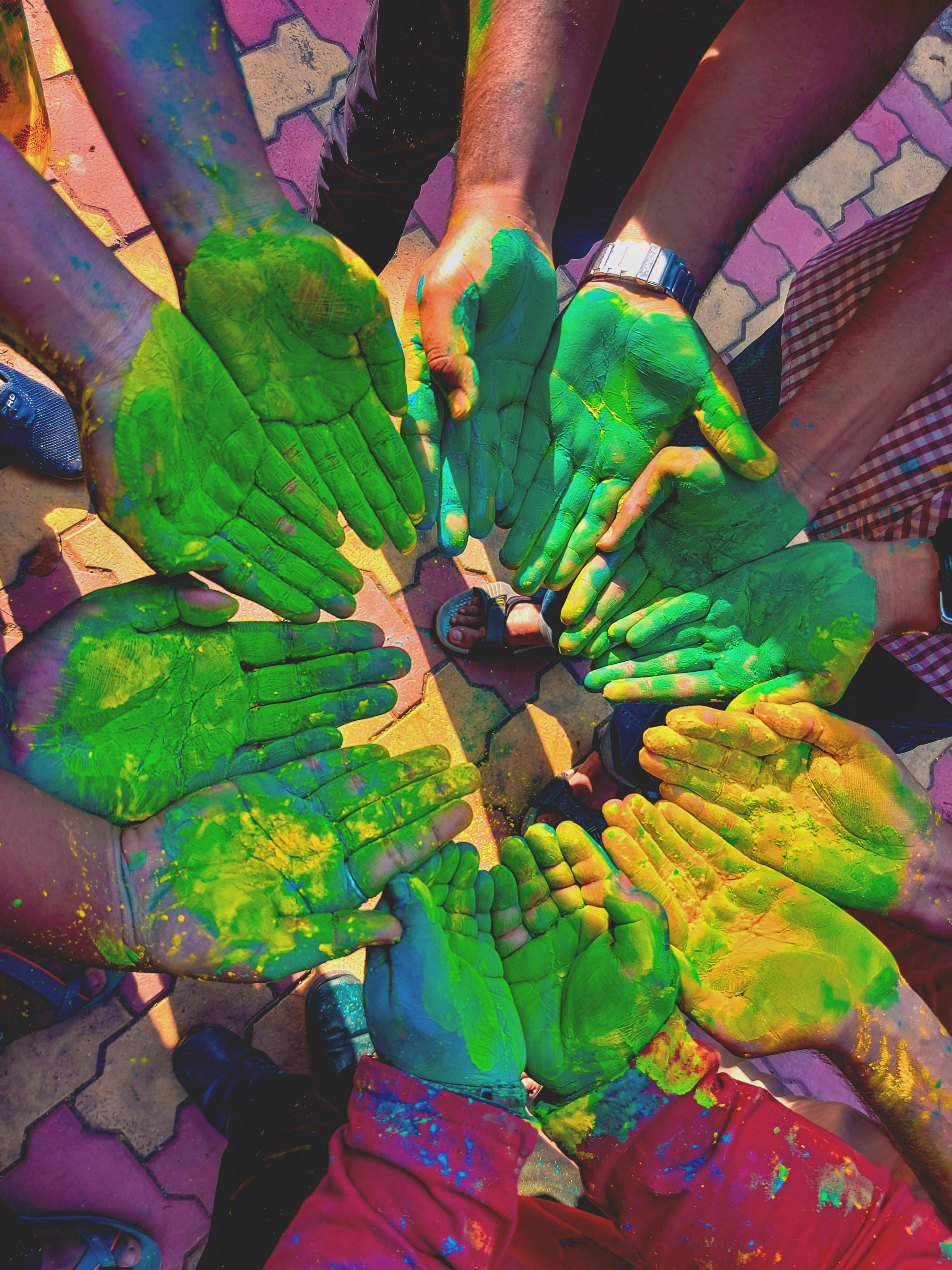 Photo of Four People Showing Painted Hands · Free Stock Photo