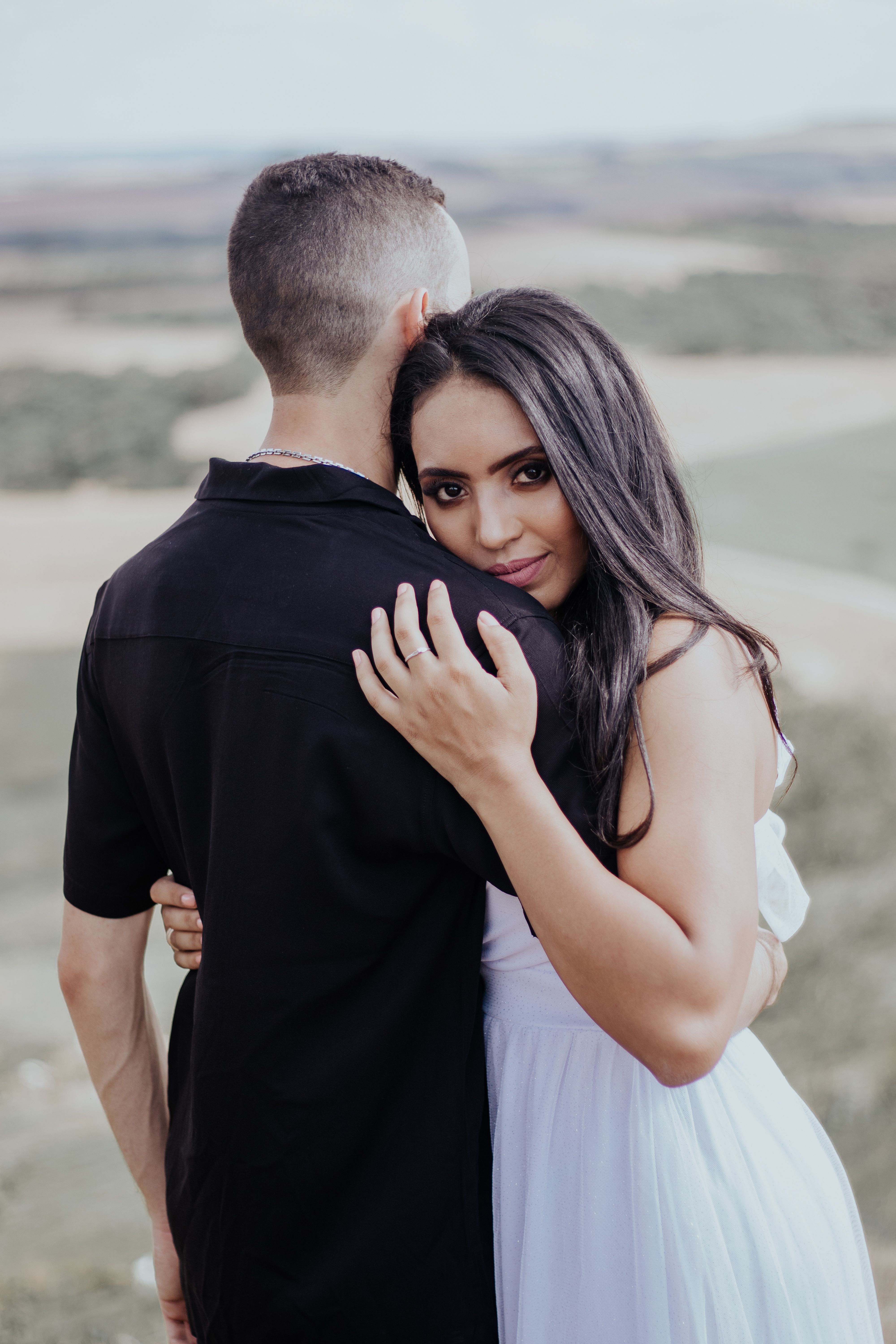 Portrait of a Woman Being Hugged by a Man · Free Stock Photo