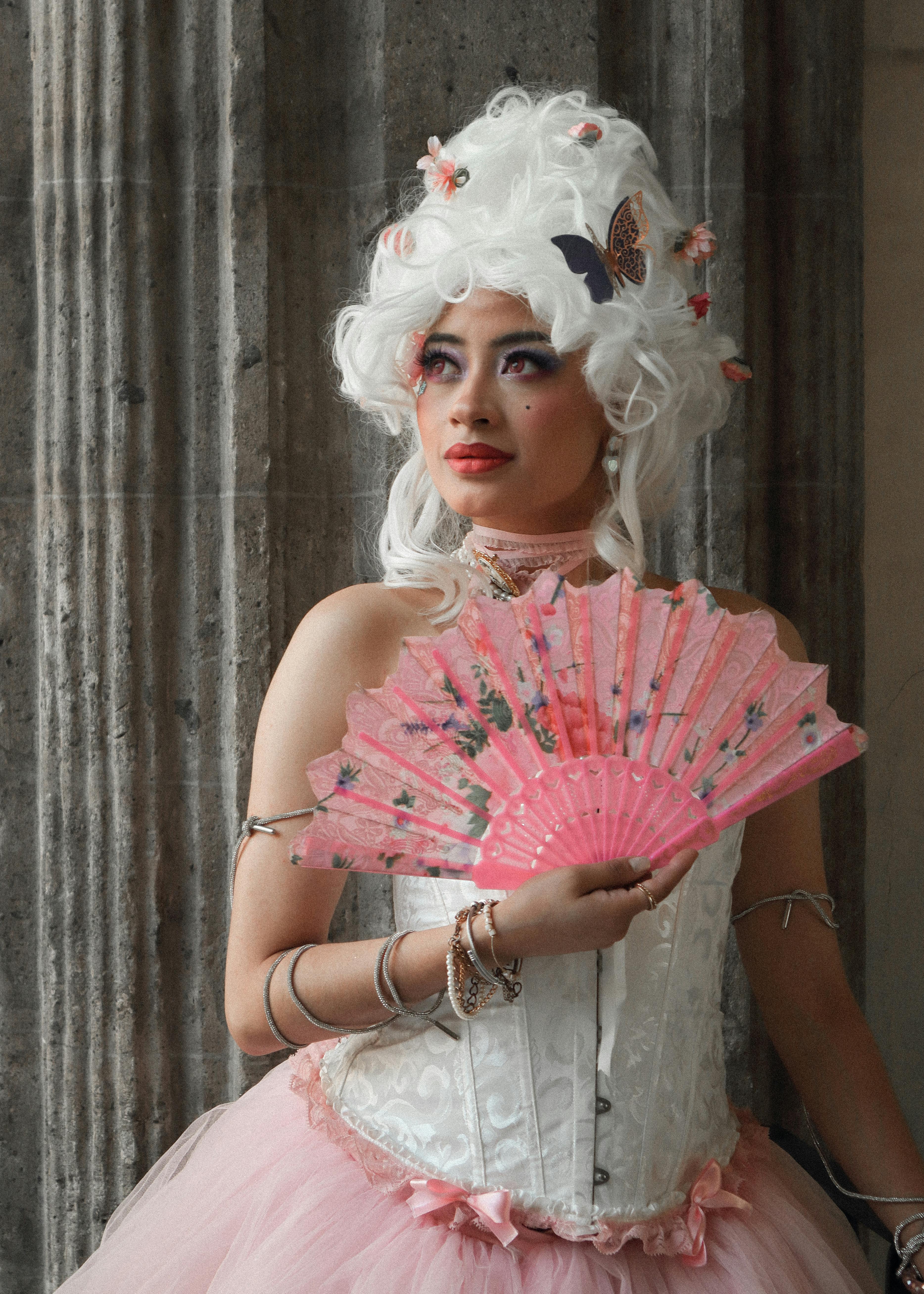 Woman in Rococo Inspired Dress and Wig Holding Pink Fan · Free Stock Photo