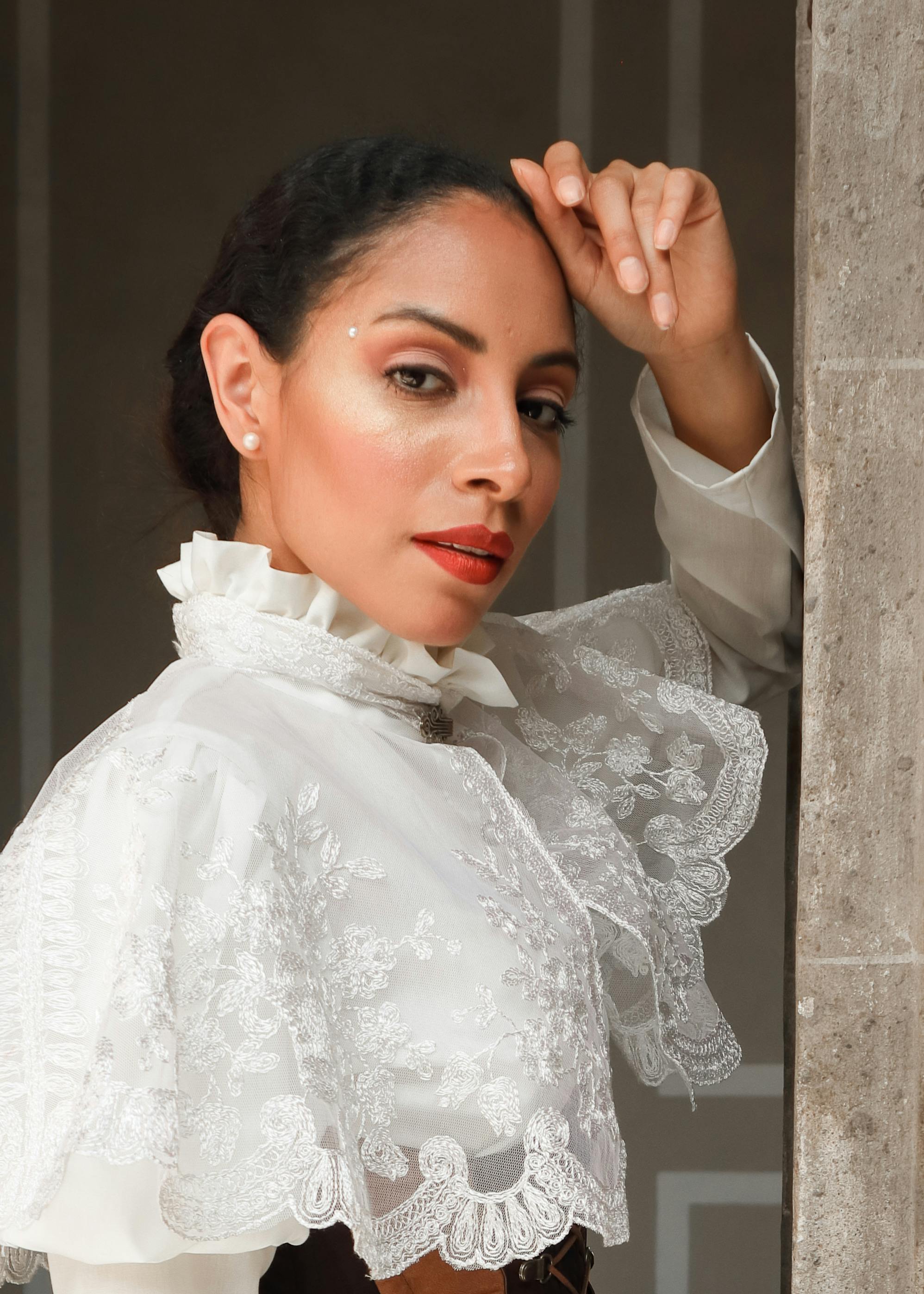 Woman in White Elegant Collar Standing Next To Wall · Free Stock Photo