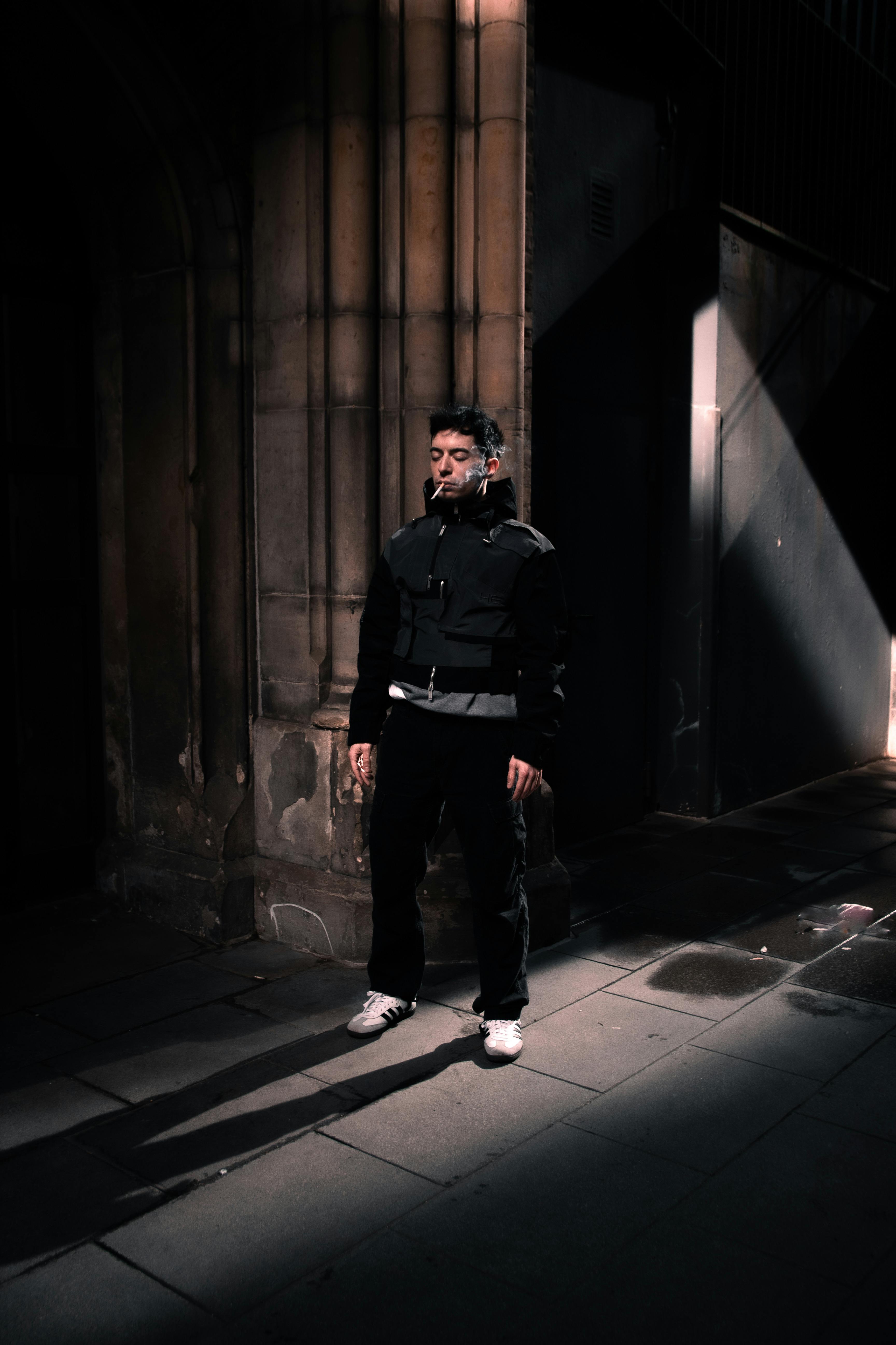 Guard Smoking Cigarette in Dark · Free Stock Photo