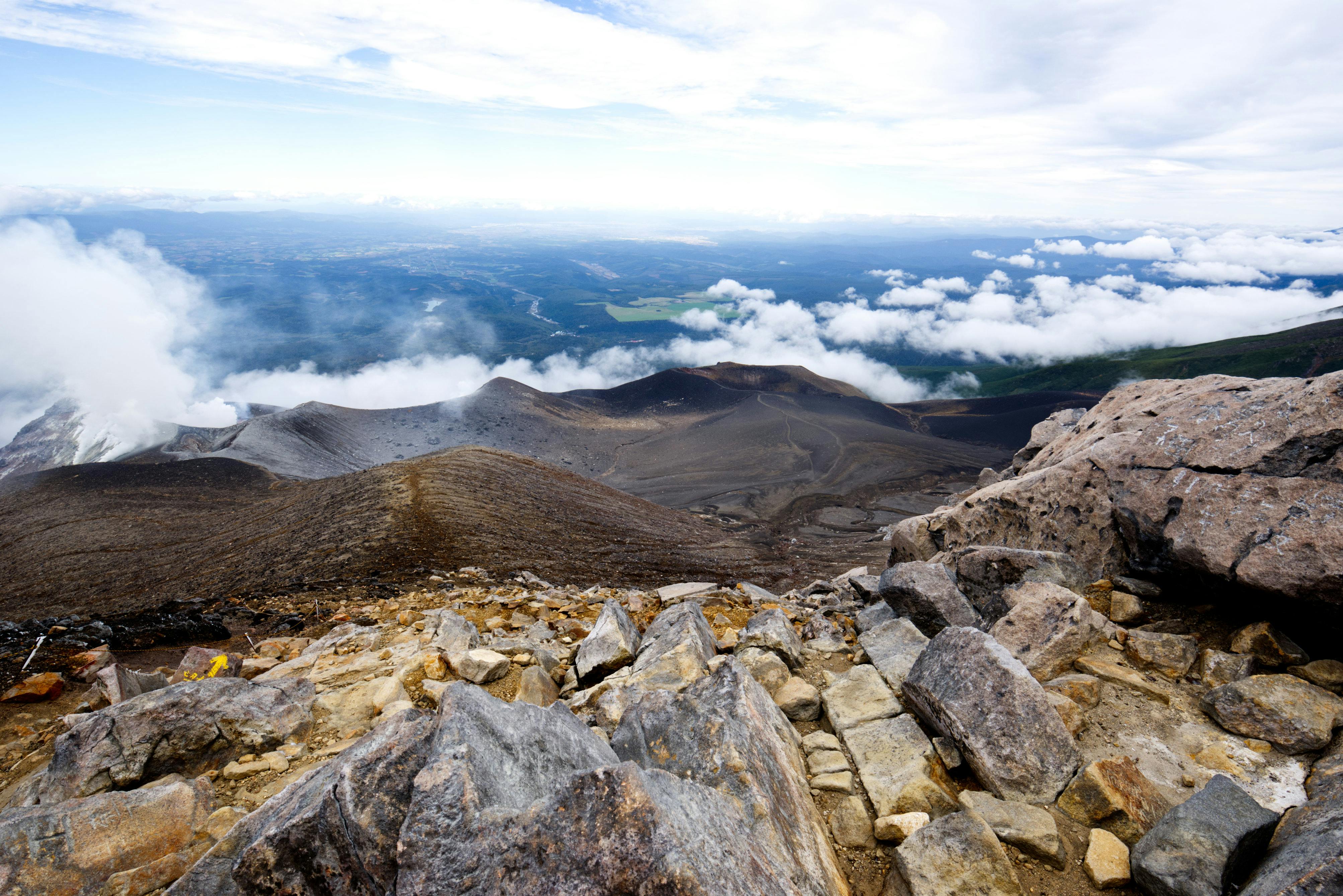 Clouds and Volcanic Slope Seen From Mountain · Free Stock Photo