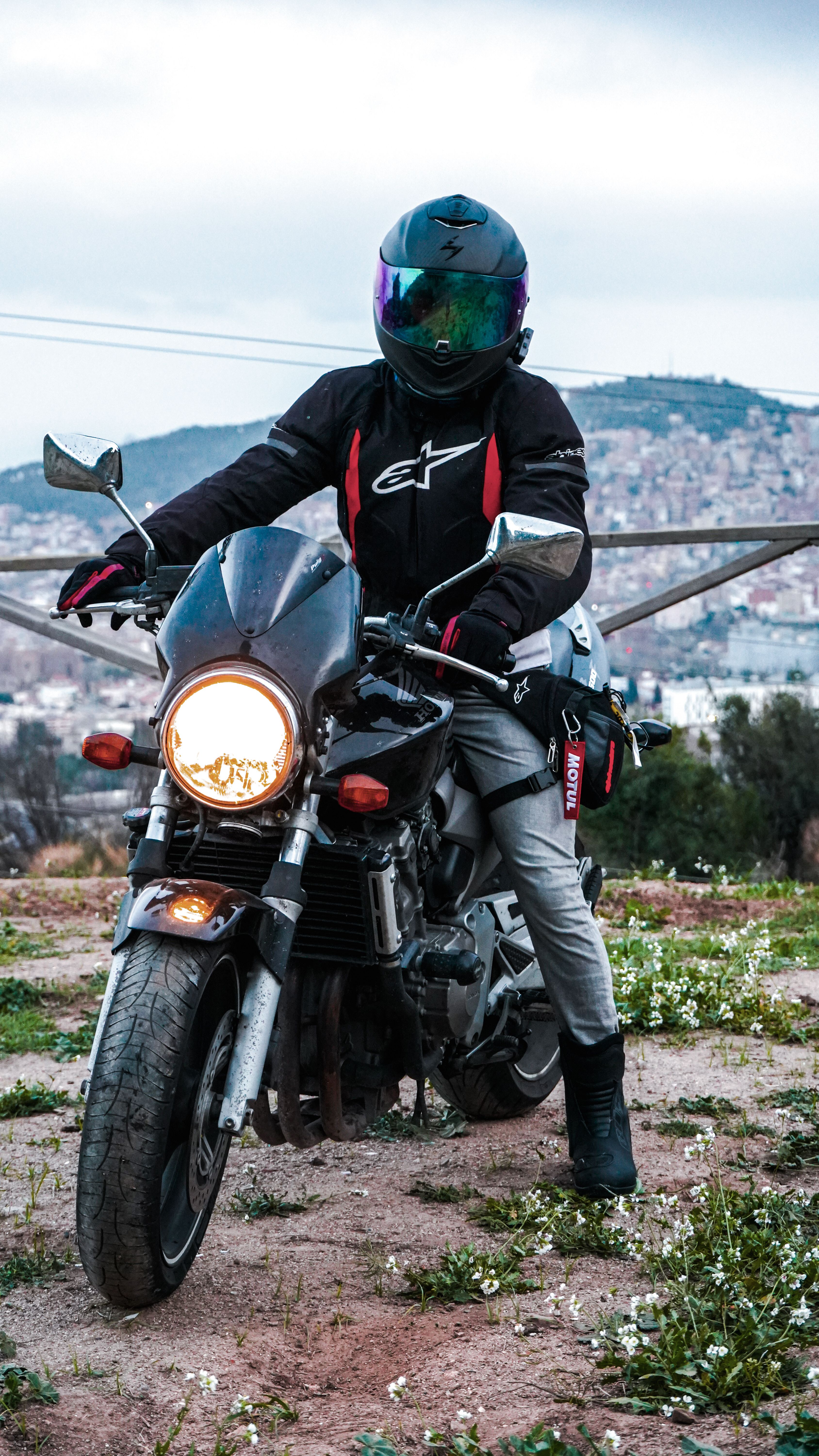 A person on a motorcycle in the middle of a field · Free Stock Photo