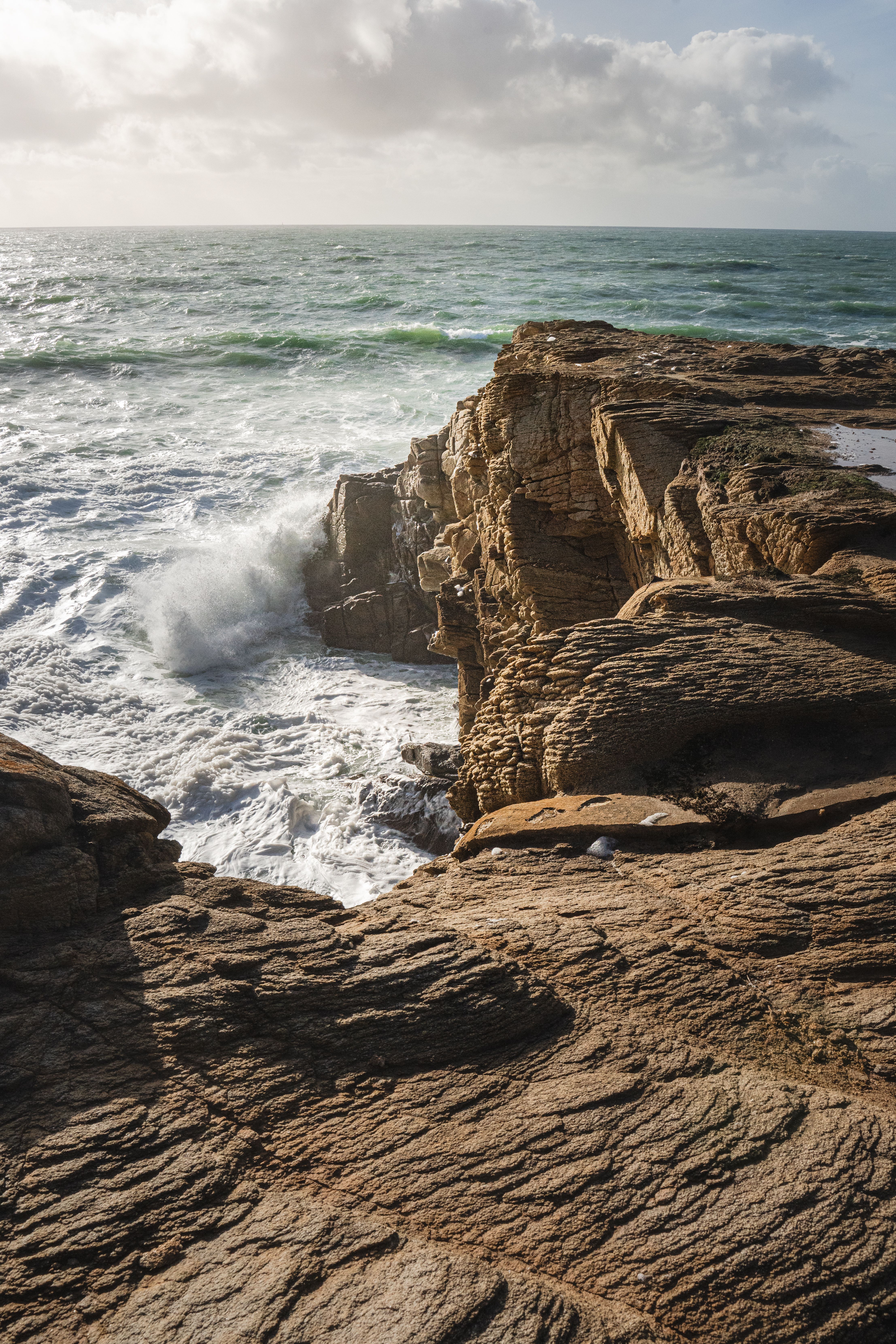 Waves Splashing against Steep Cliffs · Free Stock Photo