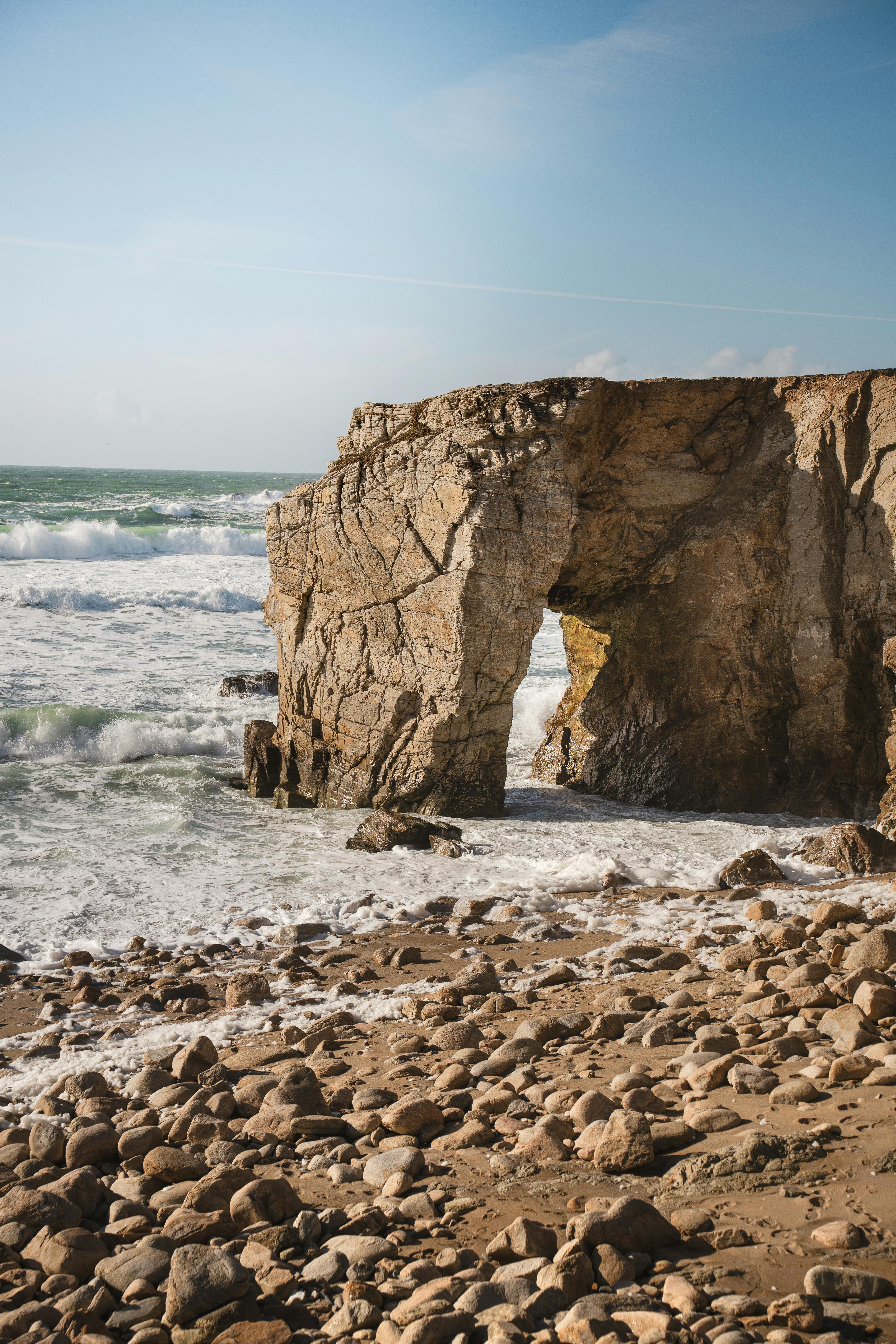 Rocks Forming Arch on Beach · Free Stock Photo