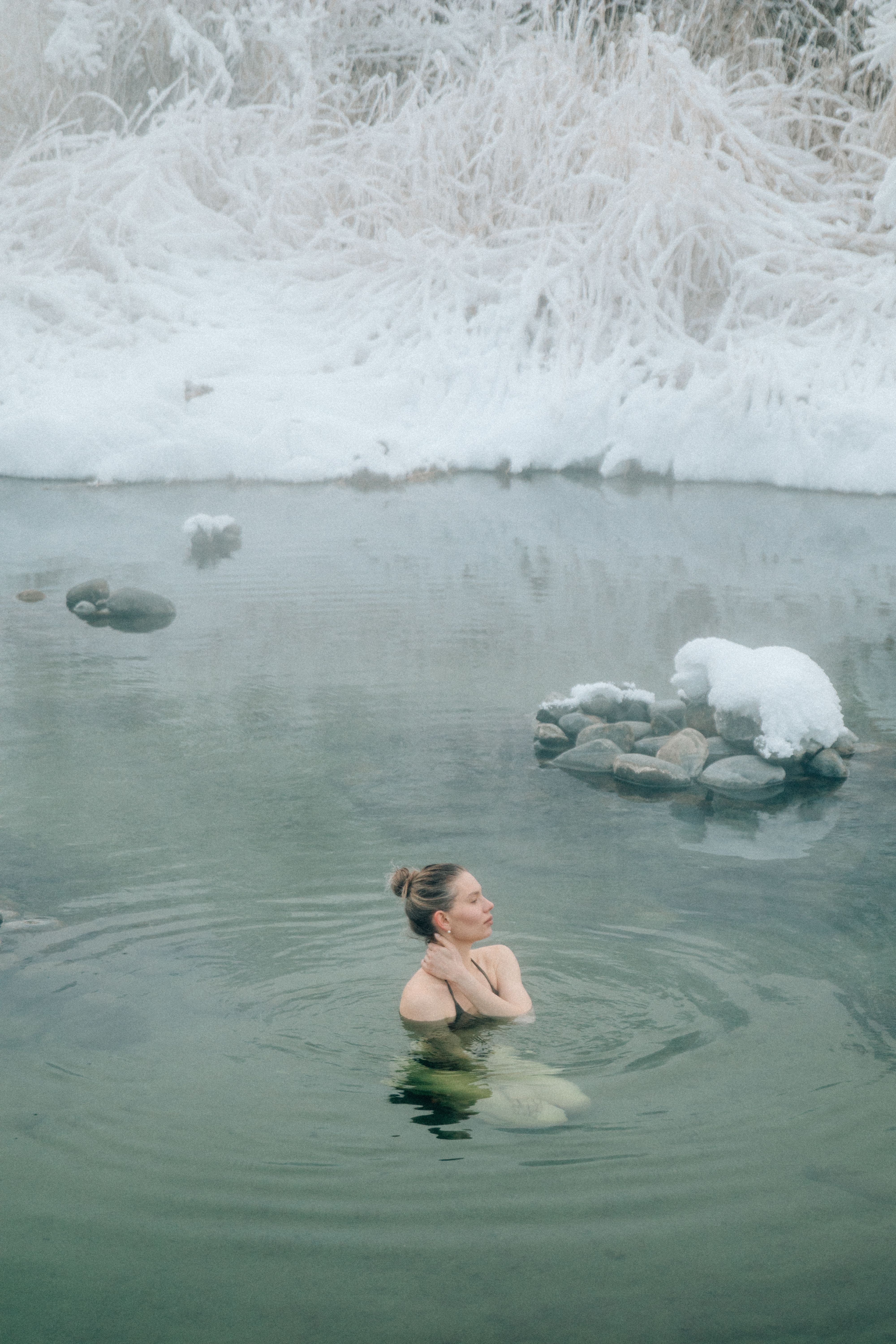 Young Woman Bathing in a Winter Lake · Free Stock Photo
