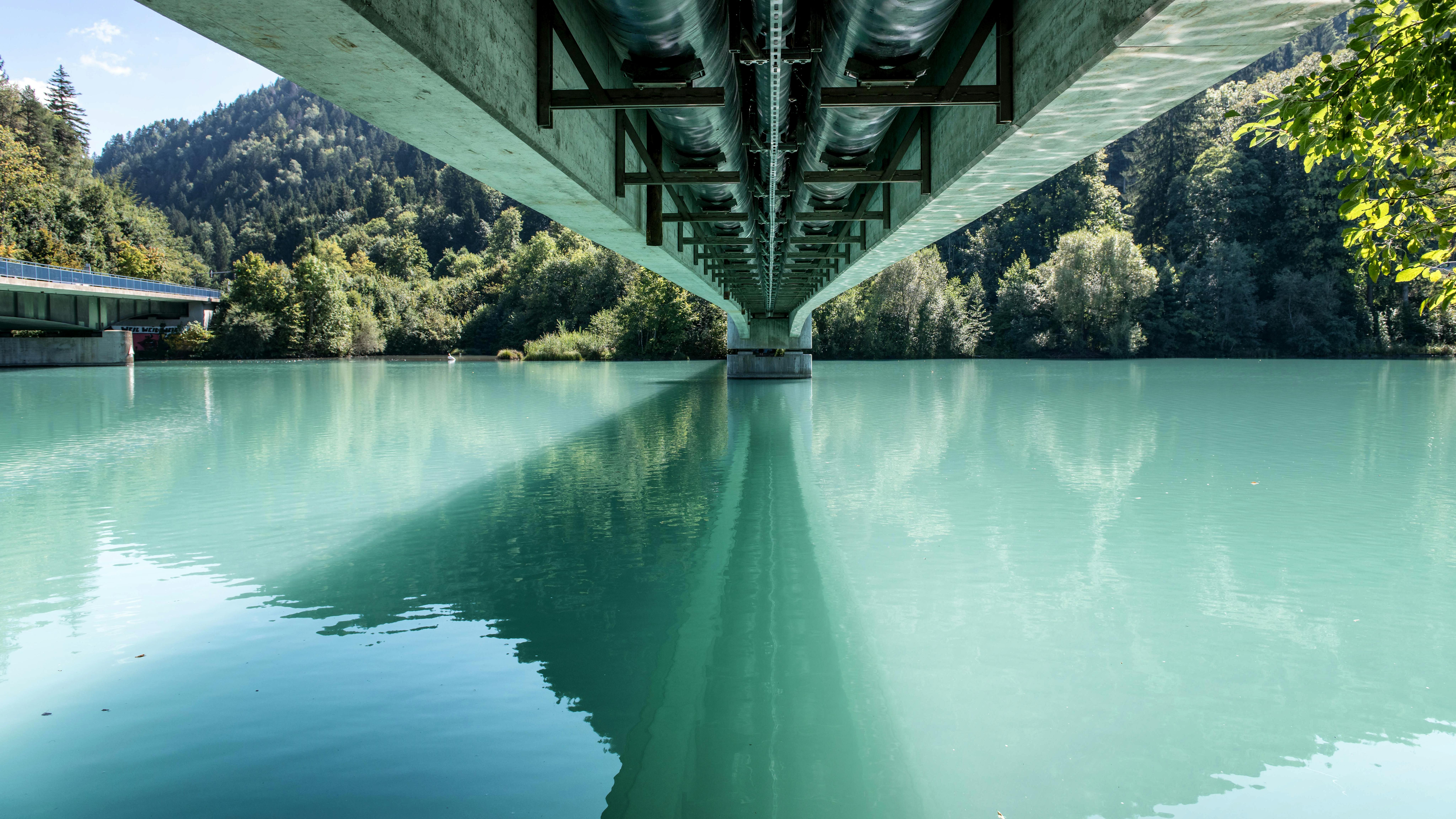 Pipes under Bridge on River · Free Stock Photo