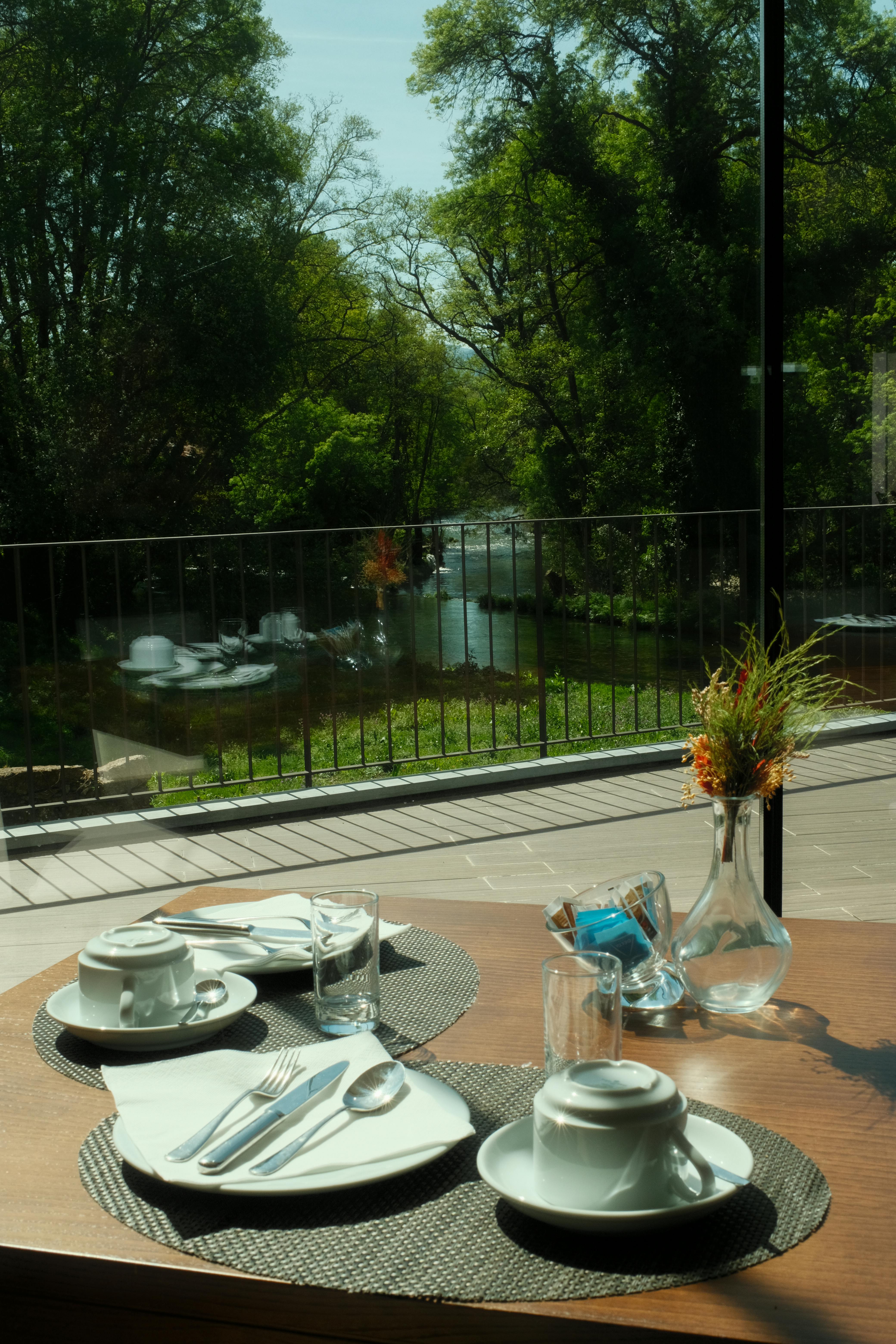 Restaurant Table with River View · Free Stock Photo