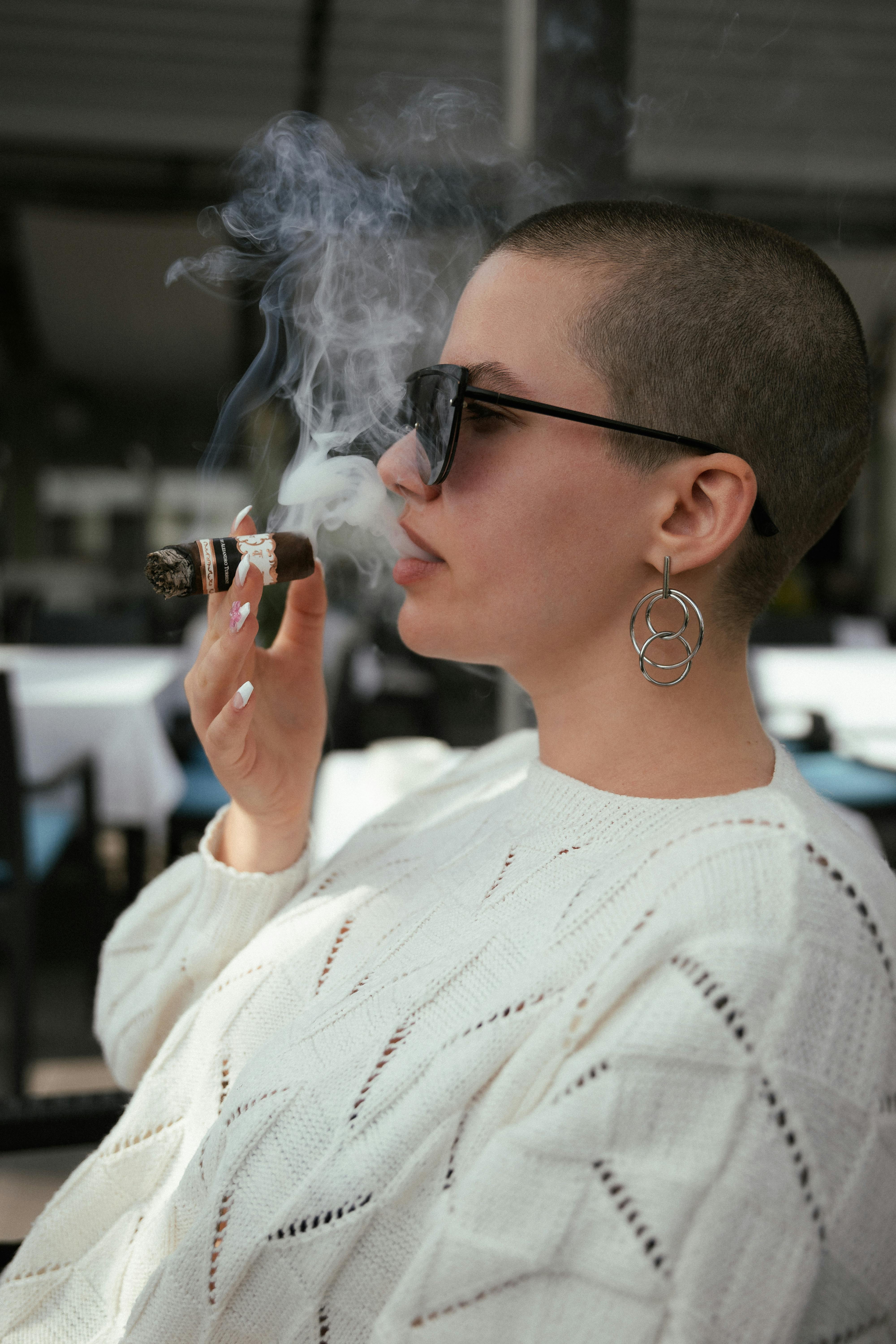 Woman with Short Hair Smoking Cigar · Free Stock Photo