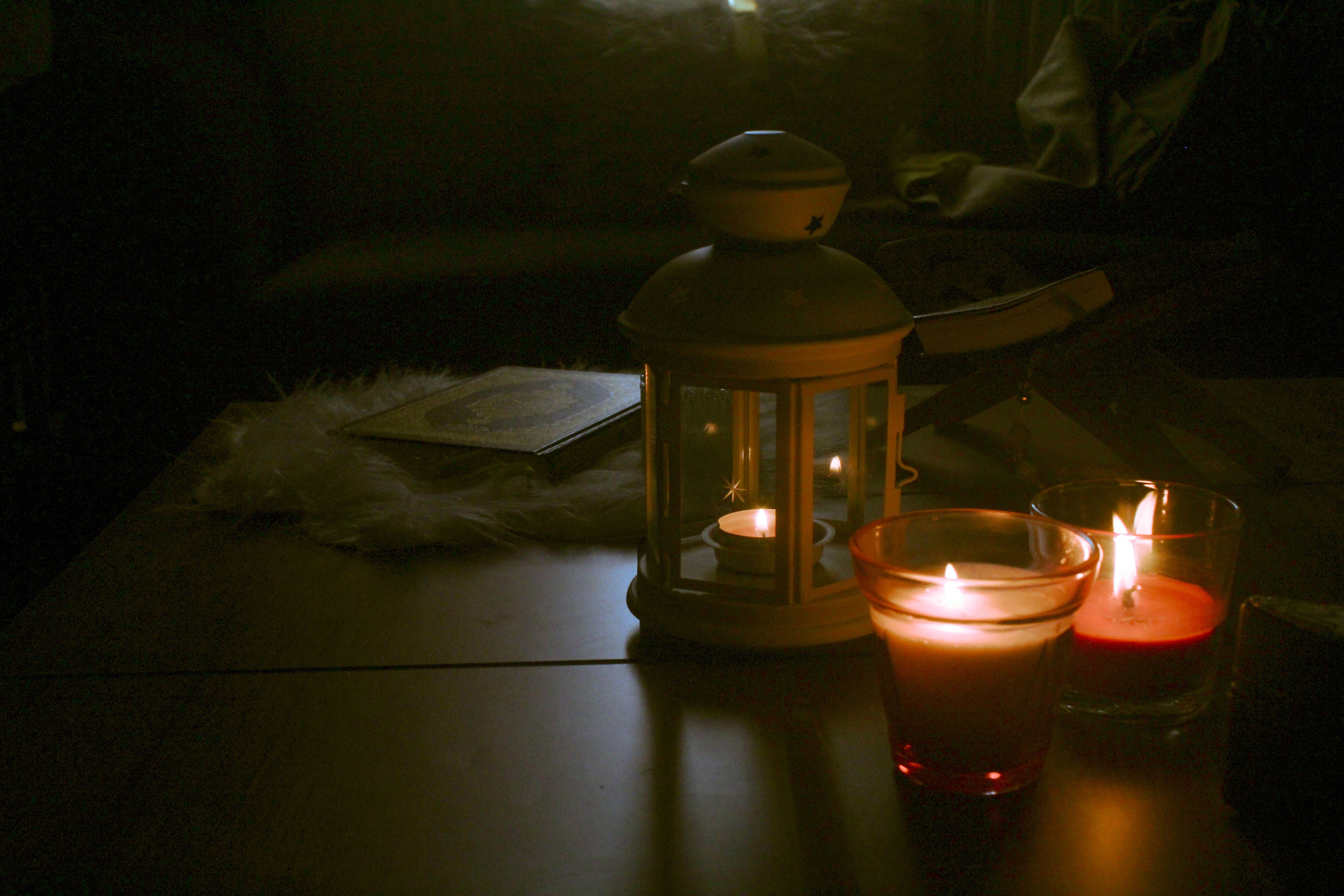 Cozy Candlelit Evening with Lantern and Book · Free Stock Photo