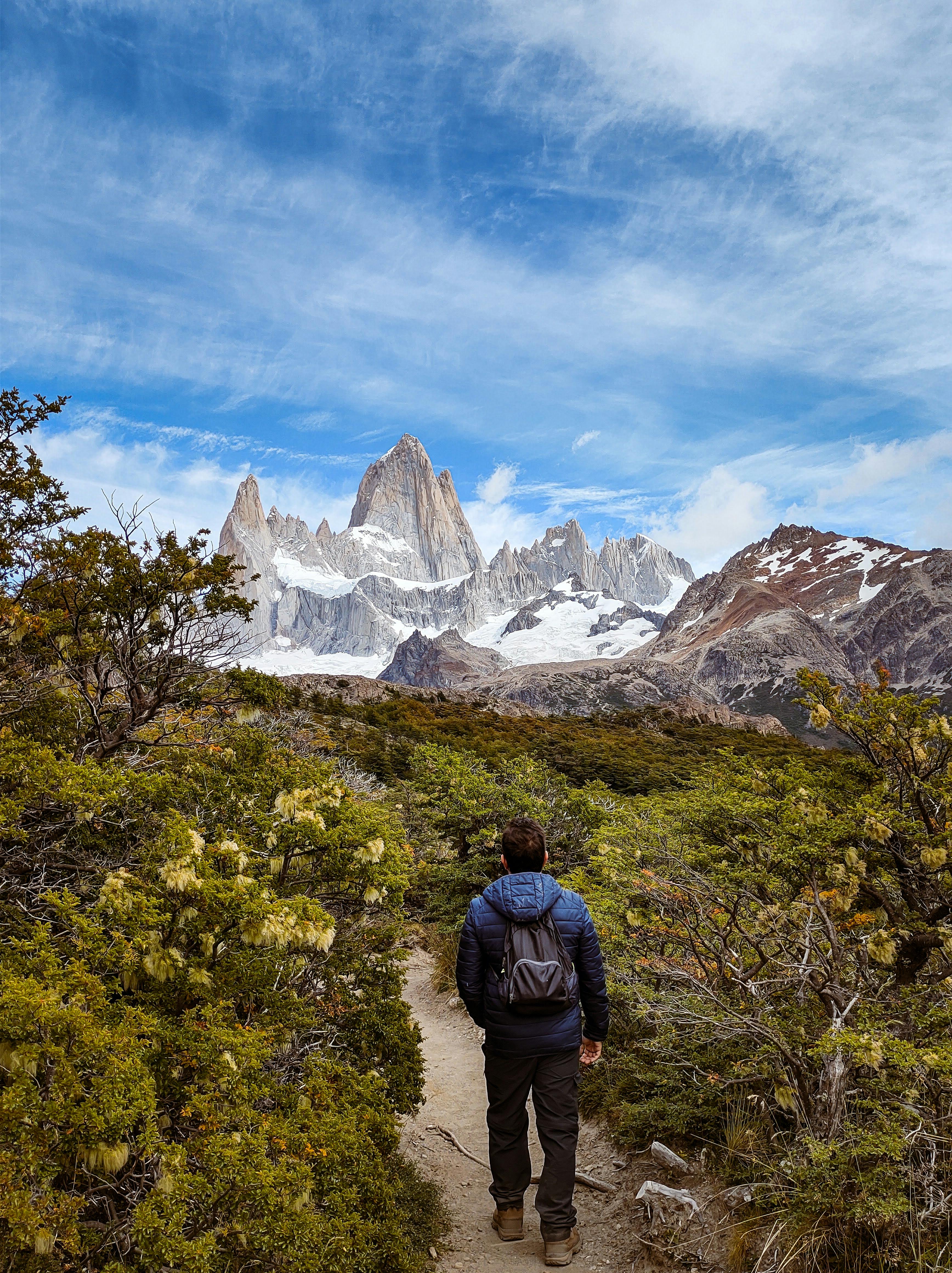 Man on a Path in a Mountain Valley · Free Stock Photo
