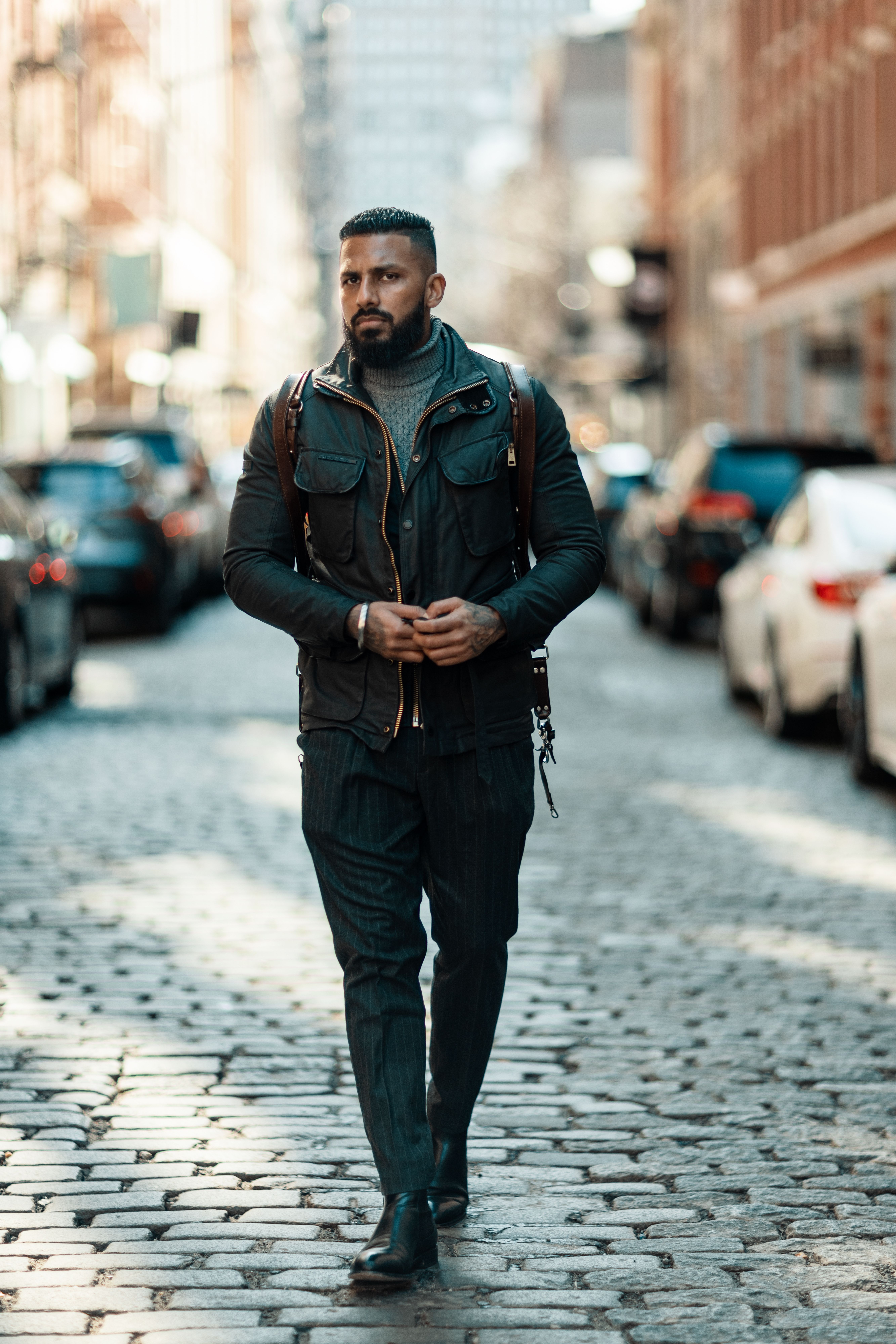 Man Walking on a Pavement Among Cars · Free Stock Photo