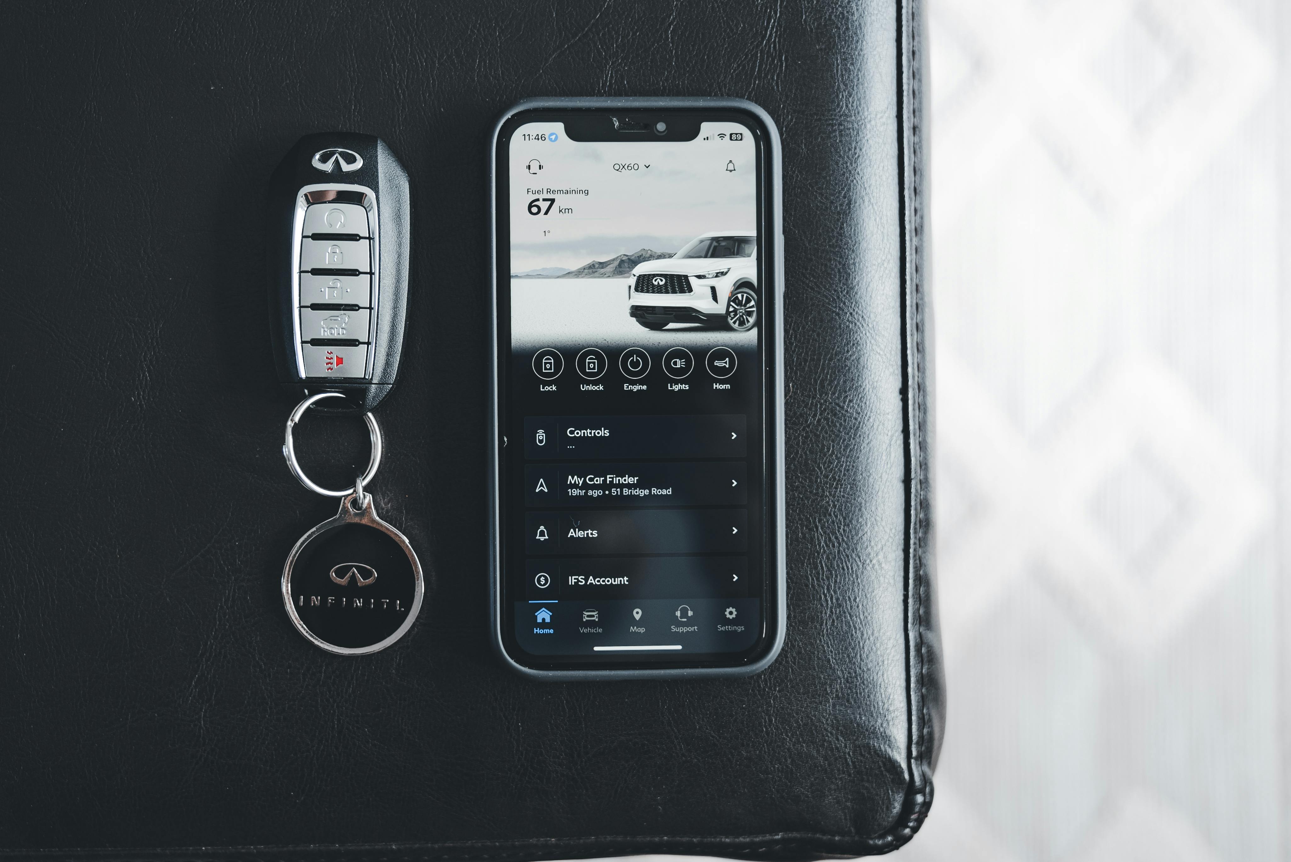 Key Fob and Smartphone with MyINFINITY App for Infiniti QX60 · Free Stock Photo