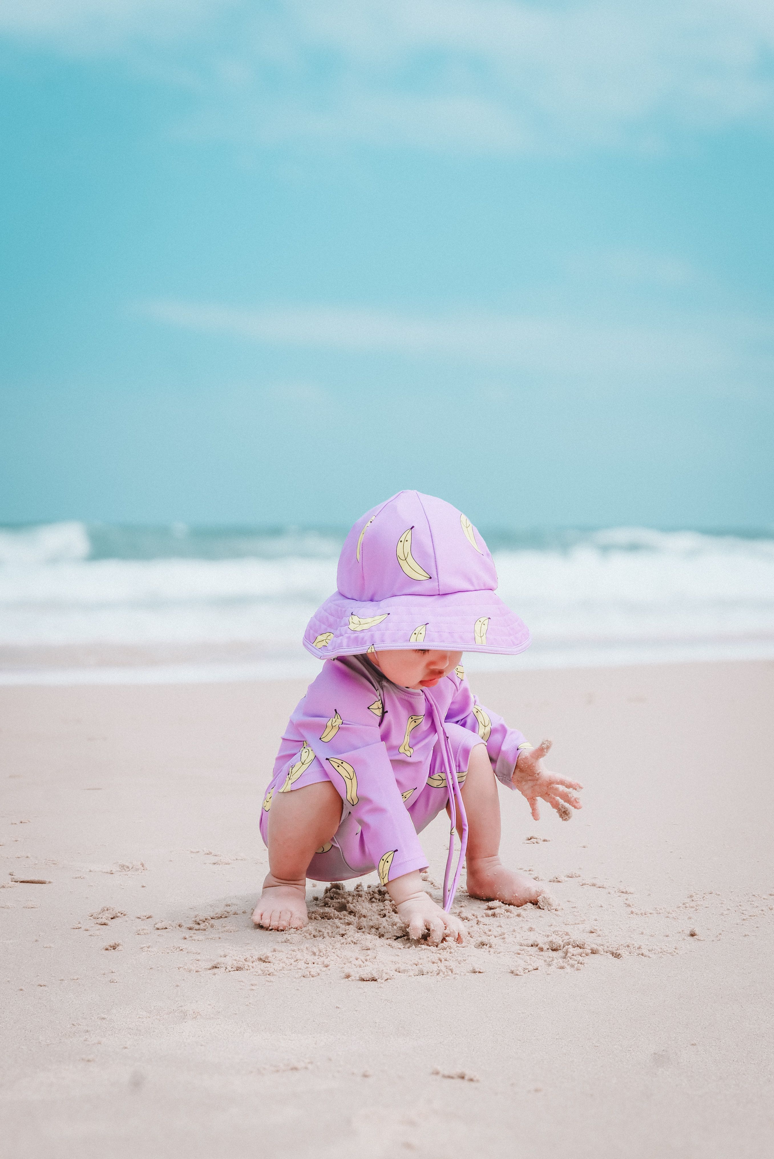 Baby Girl Playing on Sand on Beach · Free Stock Photo