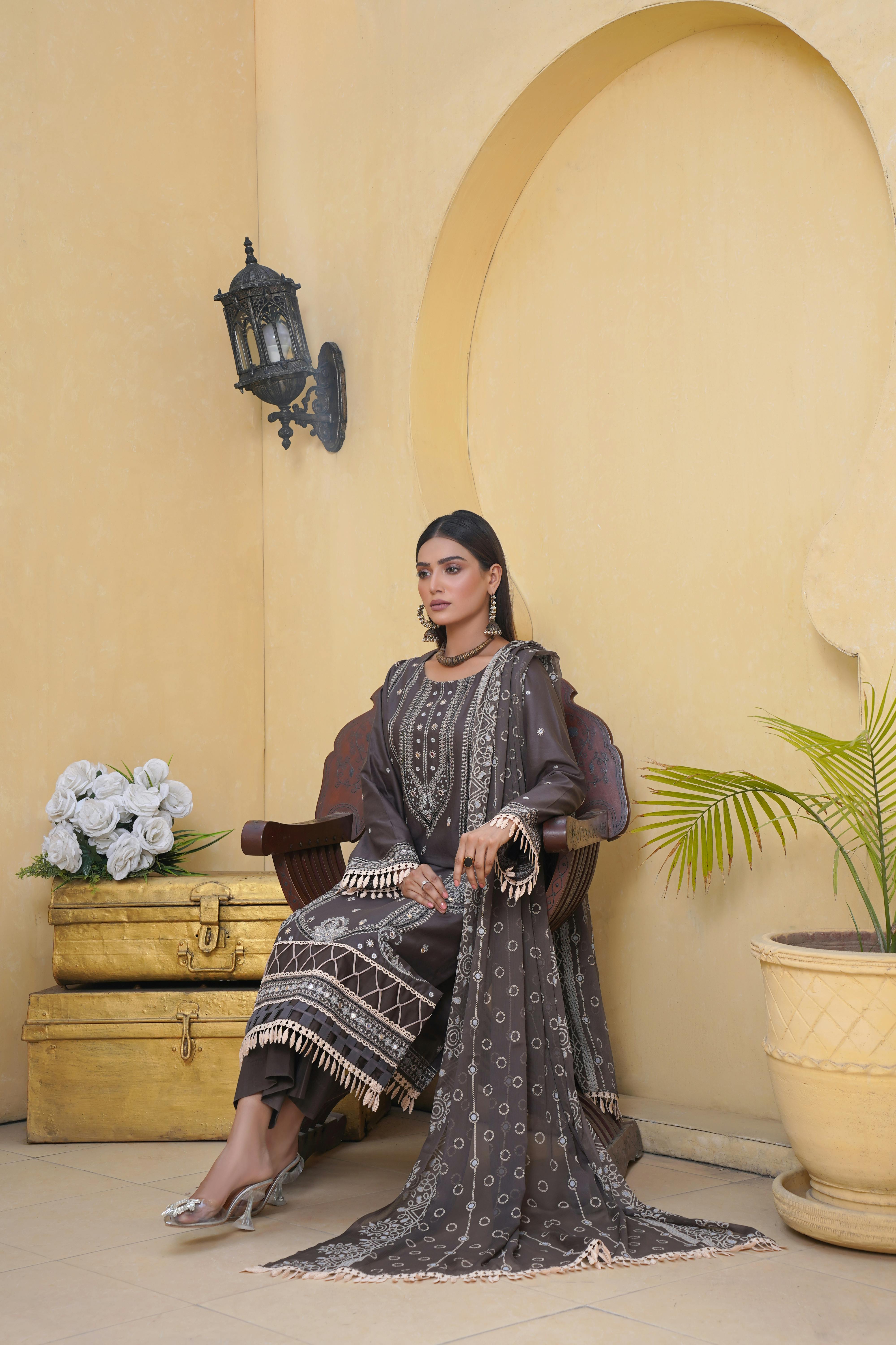 Young Woman Sitting and Posing in Traditional Clothing · Free Stock Photo