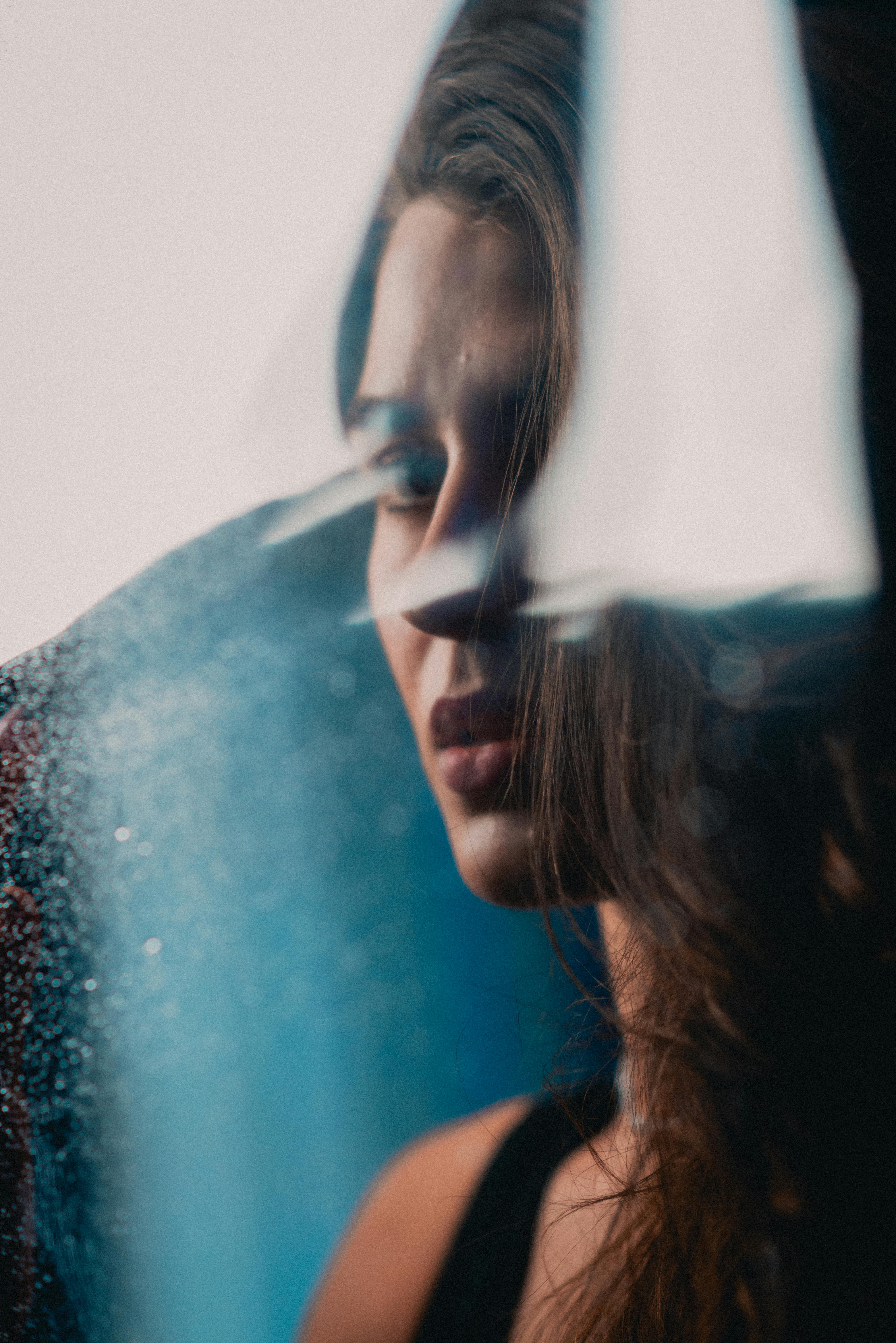 Portrait of Woman behind Window Glass · Free Stock Photo