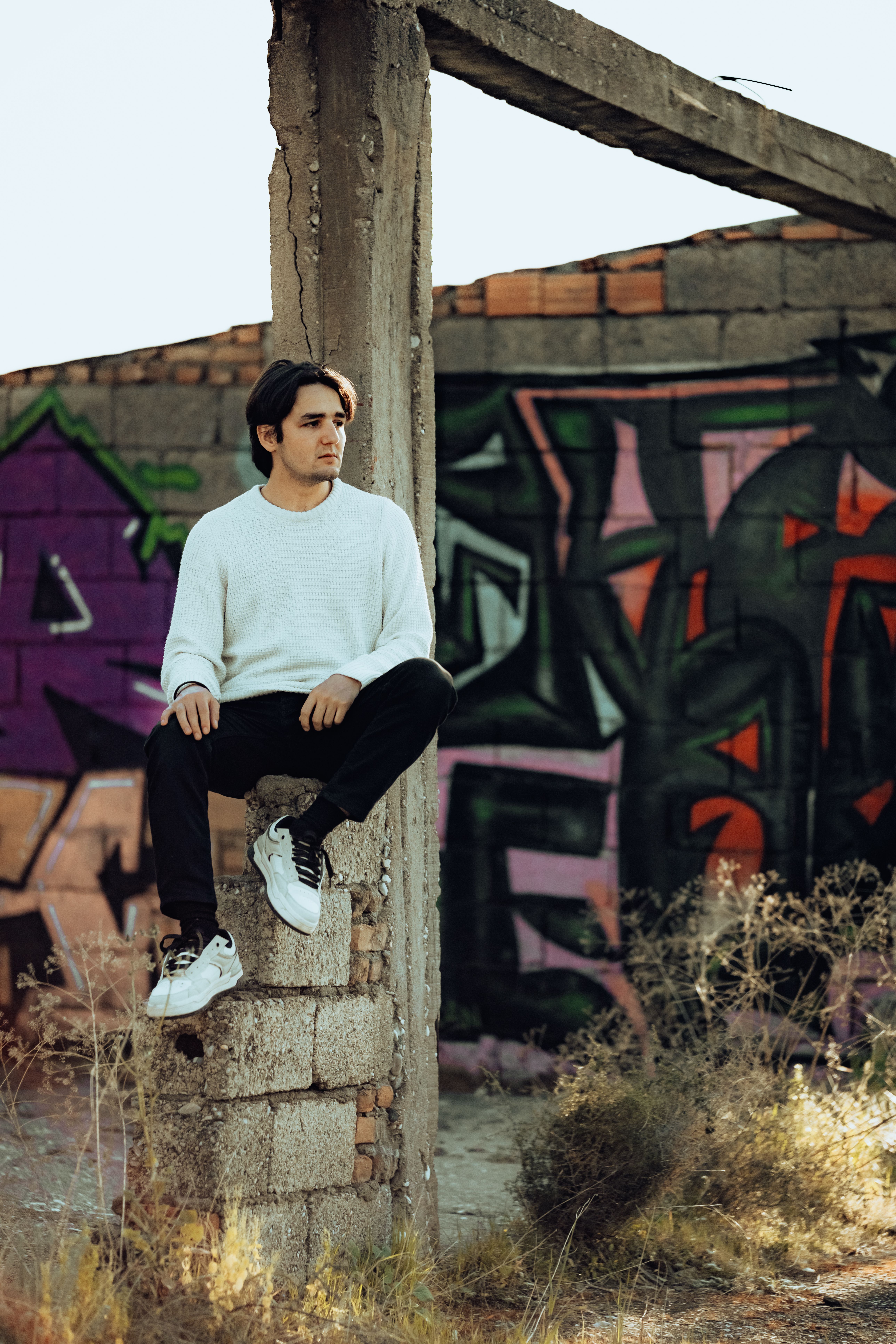 Man Sitting on Wall · Free Stock Photo