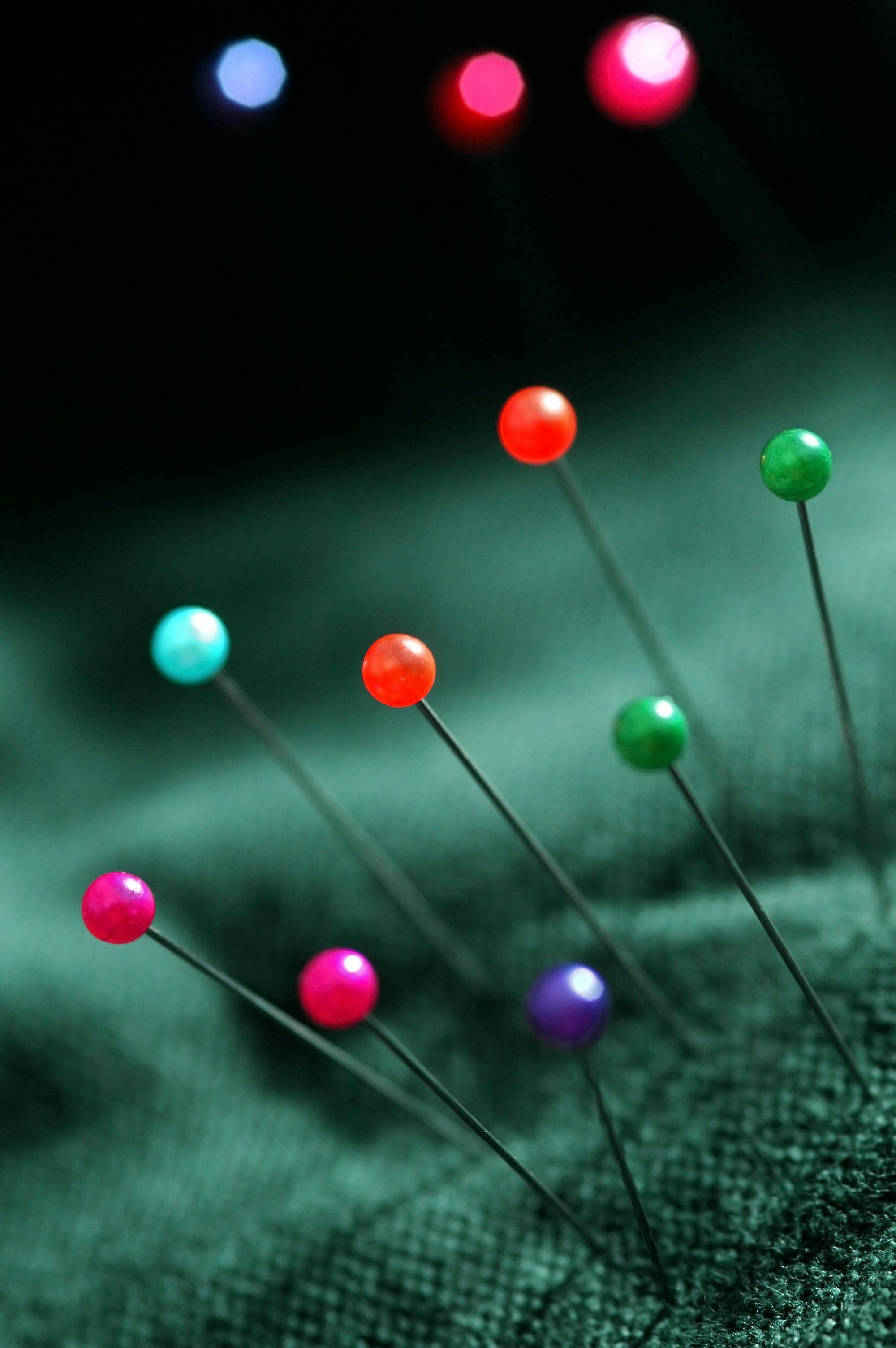 Colorful Needles in Fabric · Free Stock Photo