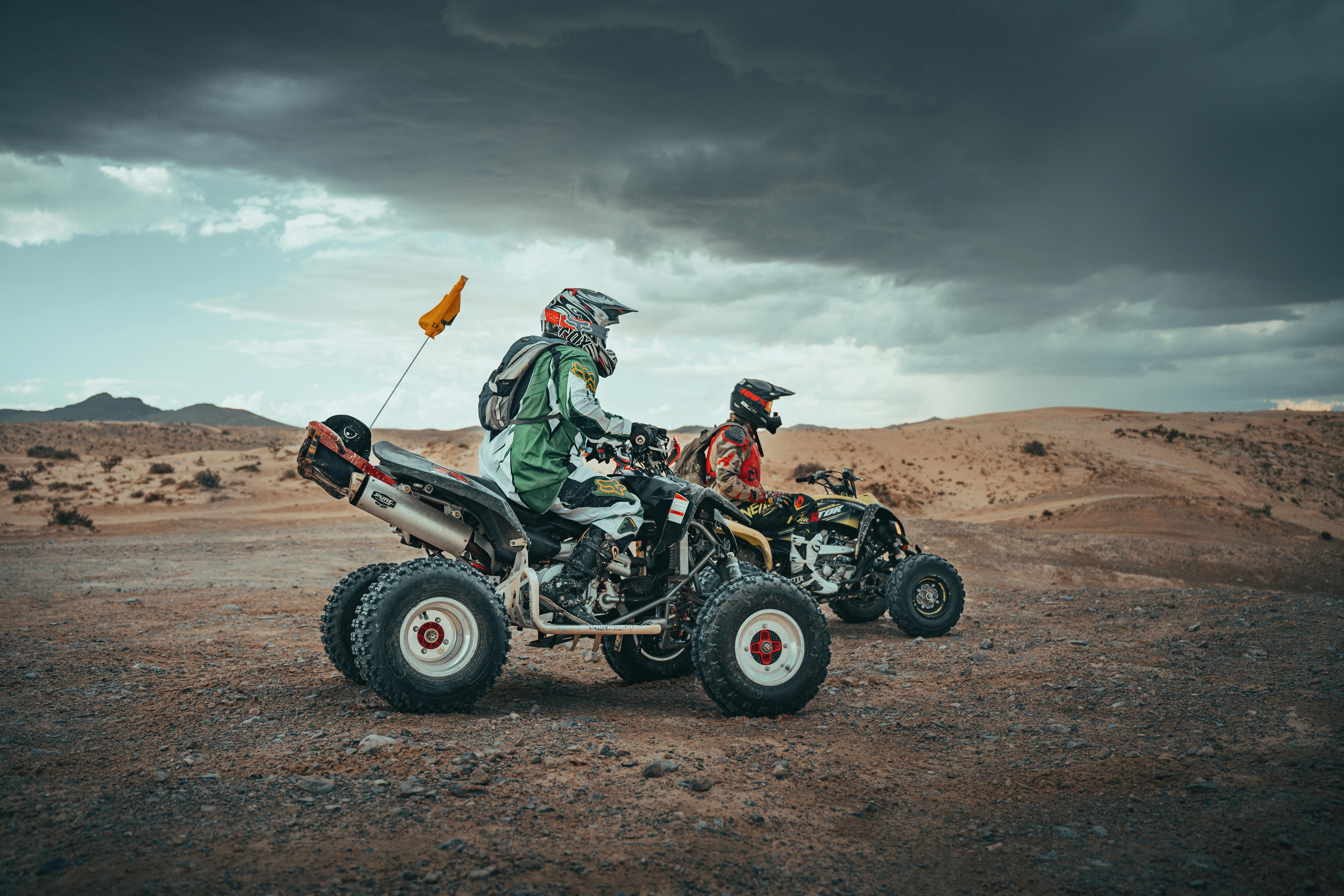 Men Riding Quads on Desert · Free Stock Photo