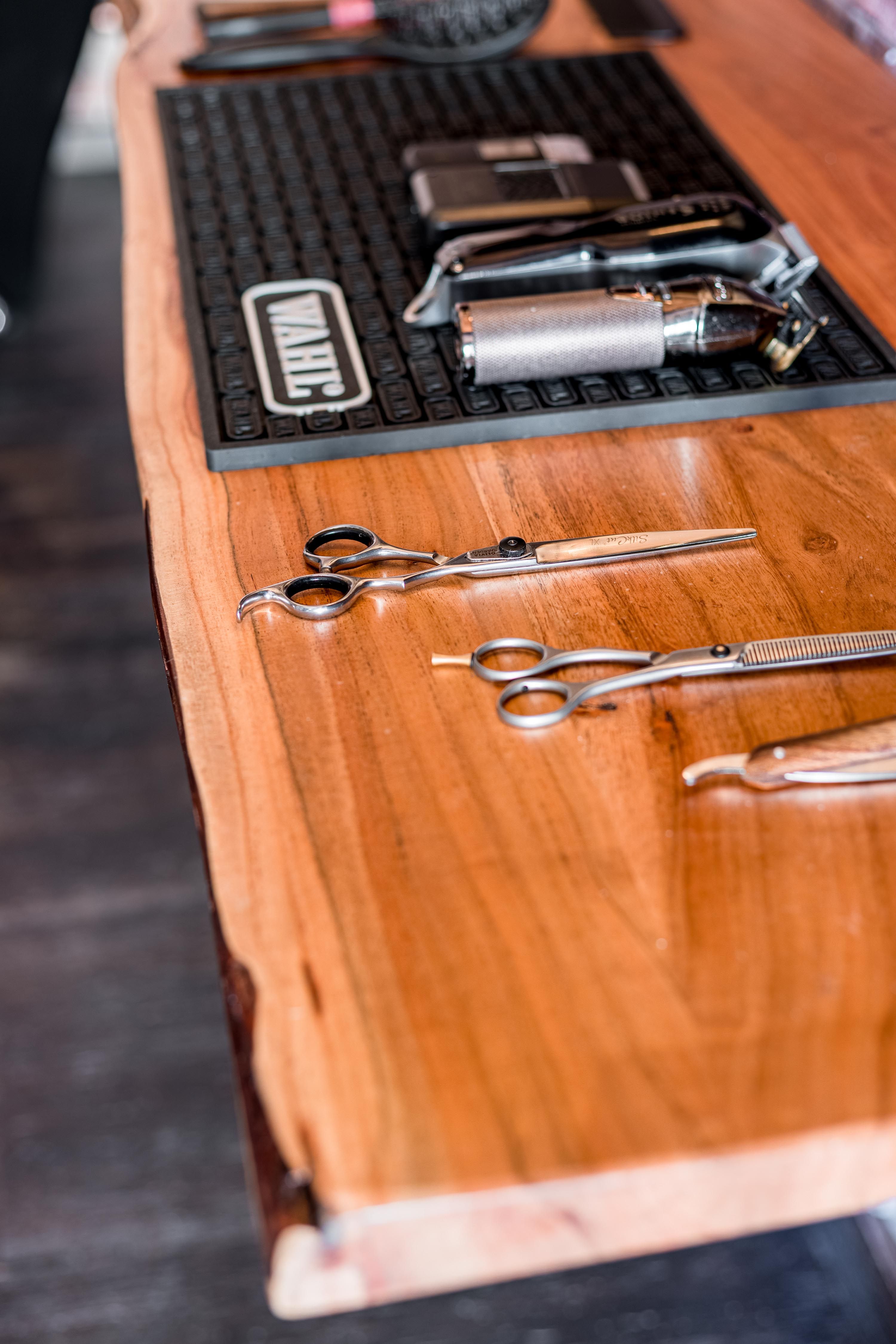 A barber's station with scissors, clippers and other tools · Free Stock ...
