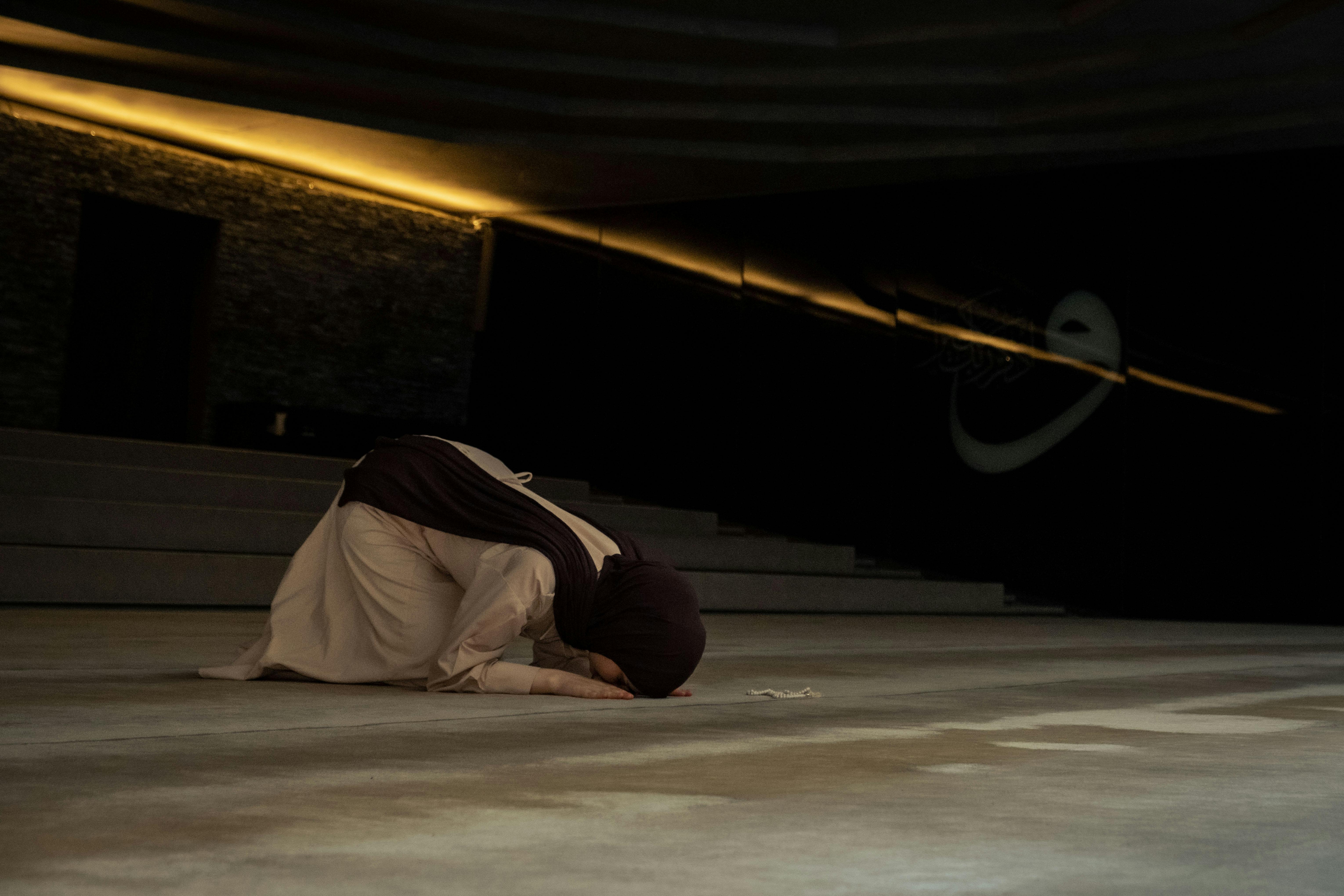 Young Woman Prostrating in a Mosque · Free Stock Photo
