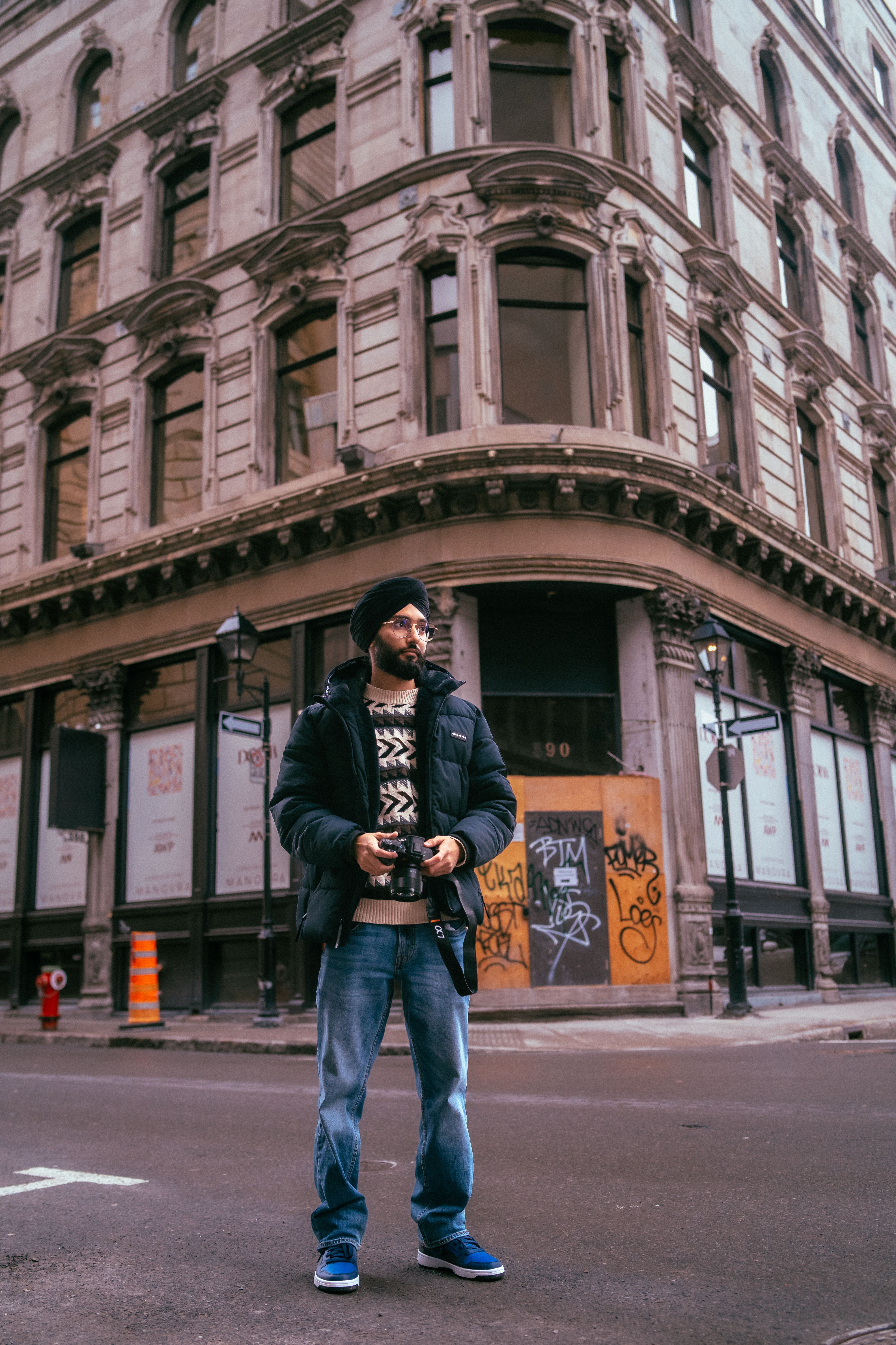 Man Standing in Front of a Classic Tenement · Free Stock Photo