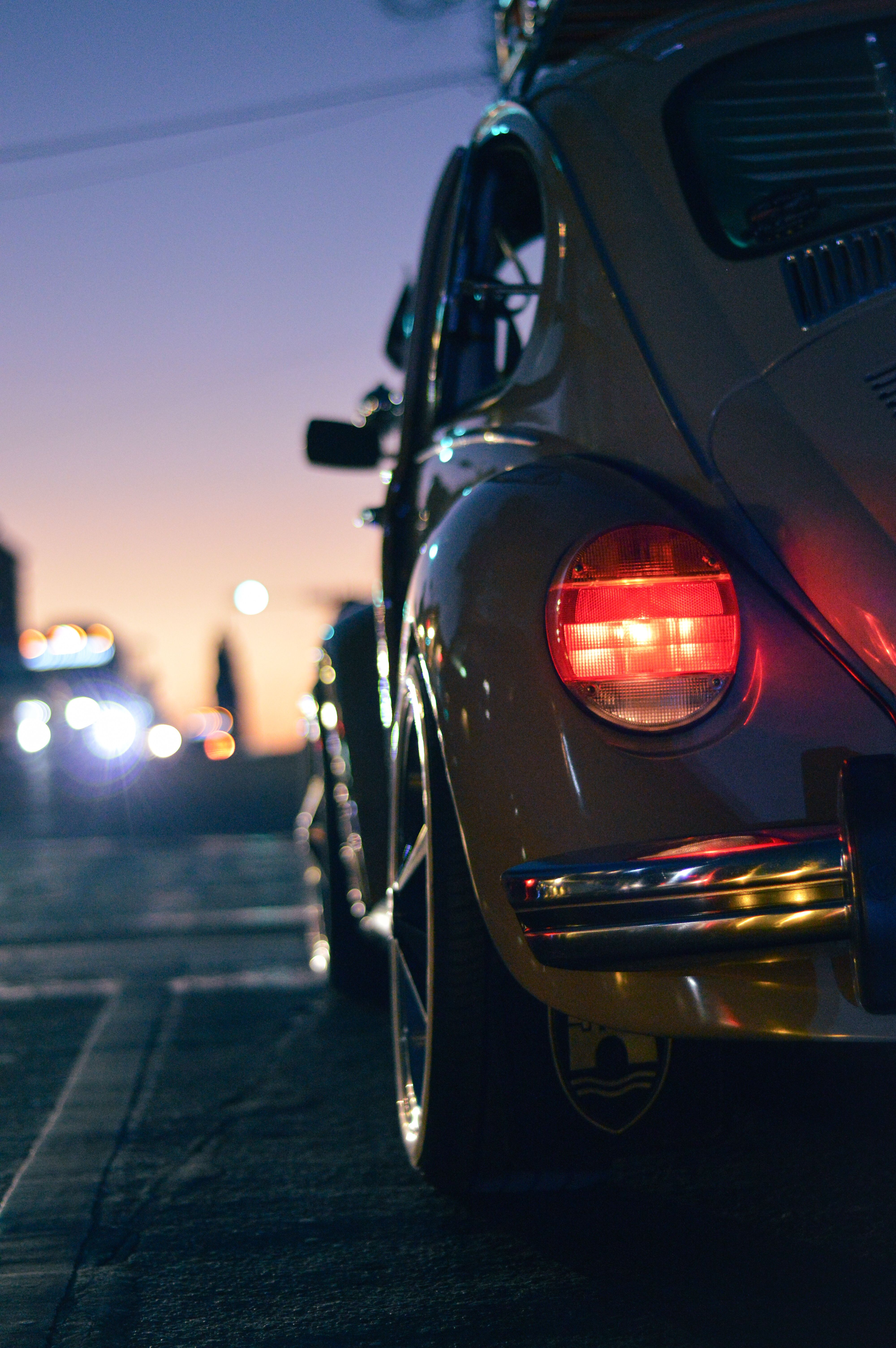 Back View of a Vintage Volkswagen Beetle on a Street at Sunset · Free ...