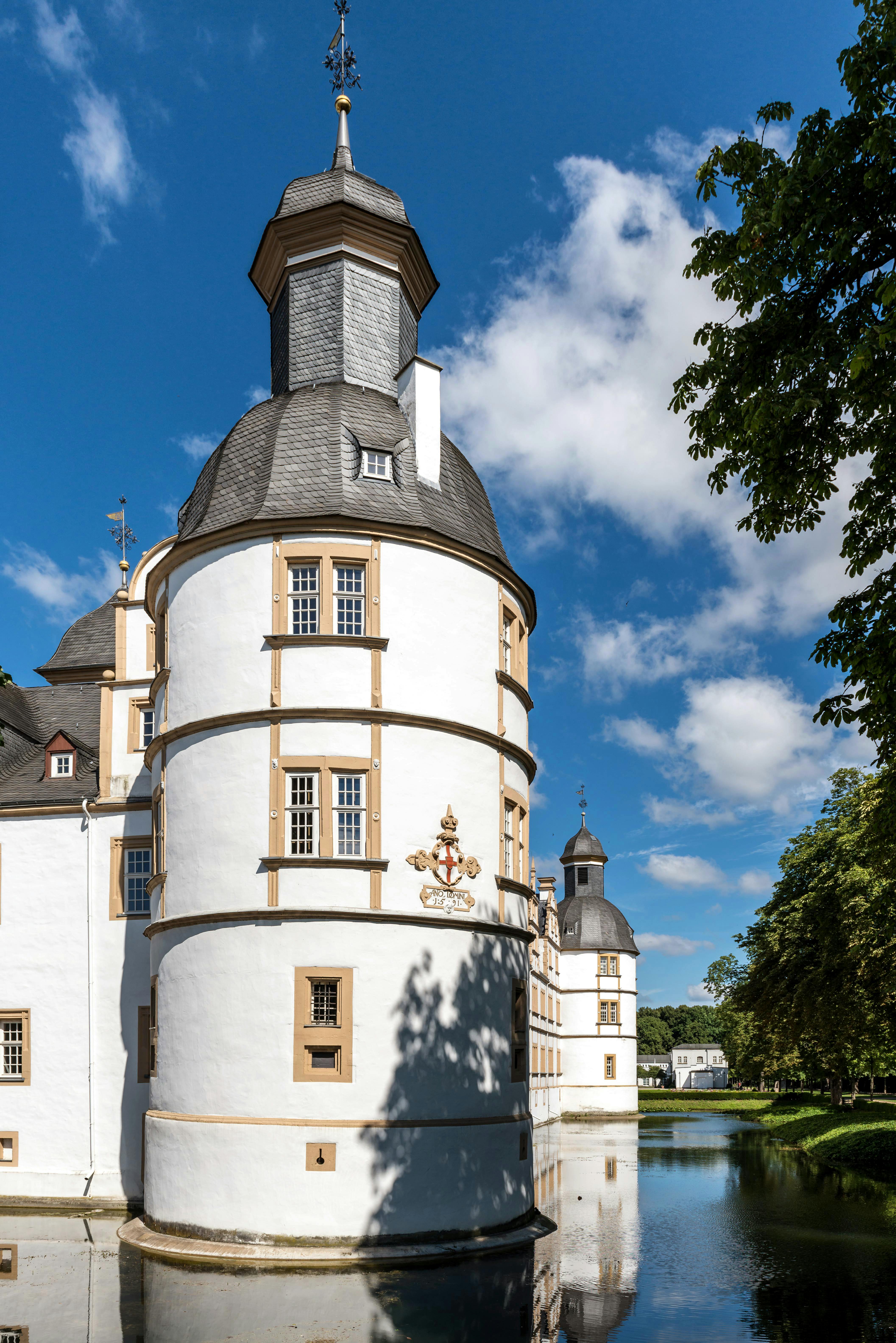 Tower of the Schloss Neuhaus Castle Surrounded by a Moat · Free Stock Photo