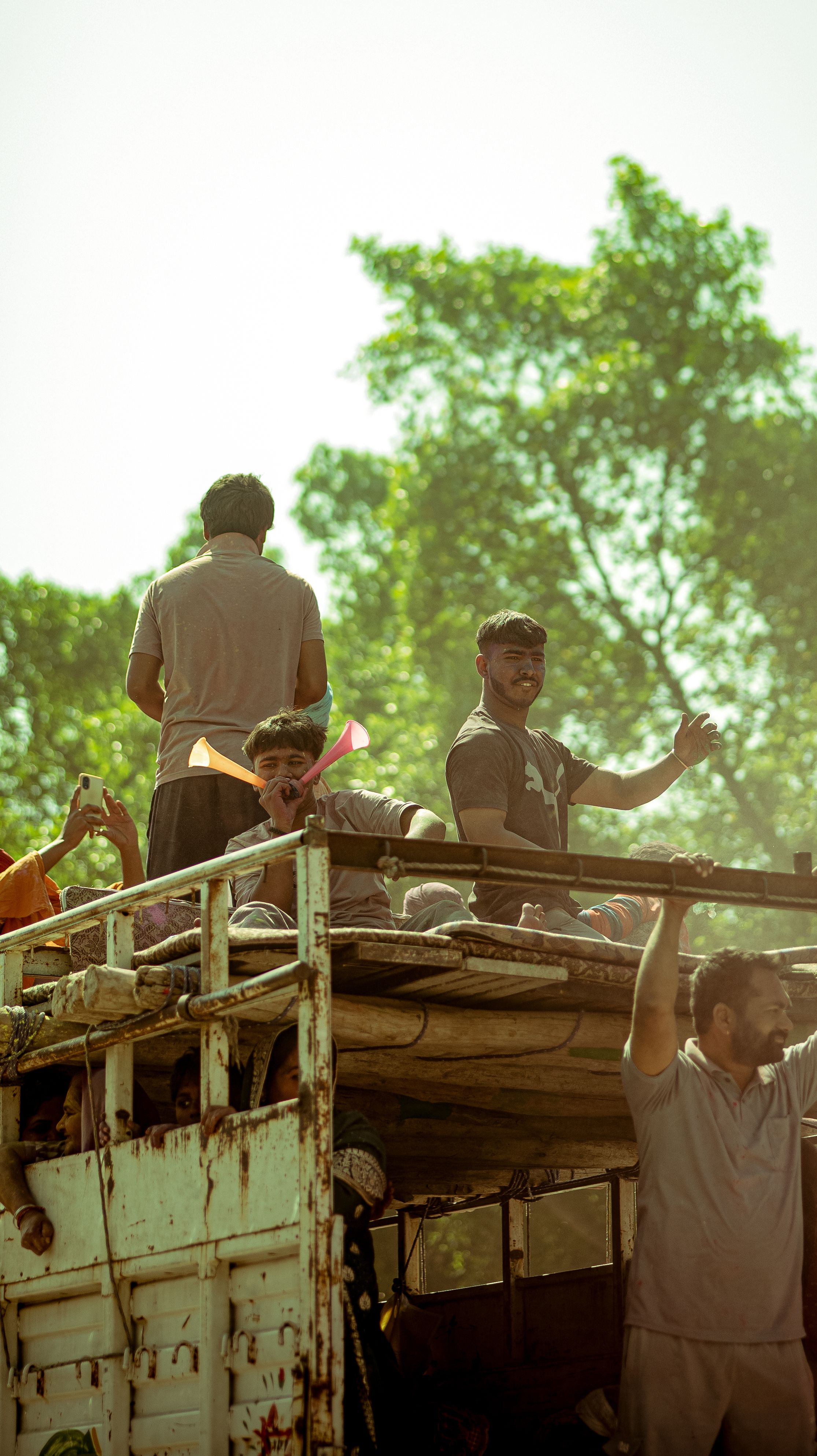 People Traveling in the Back of a Truck · Free Stock Photo