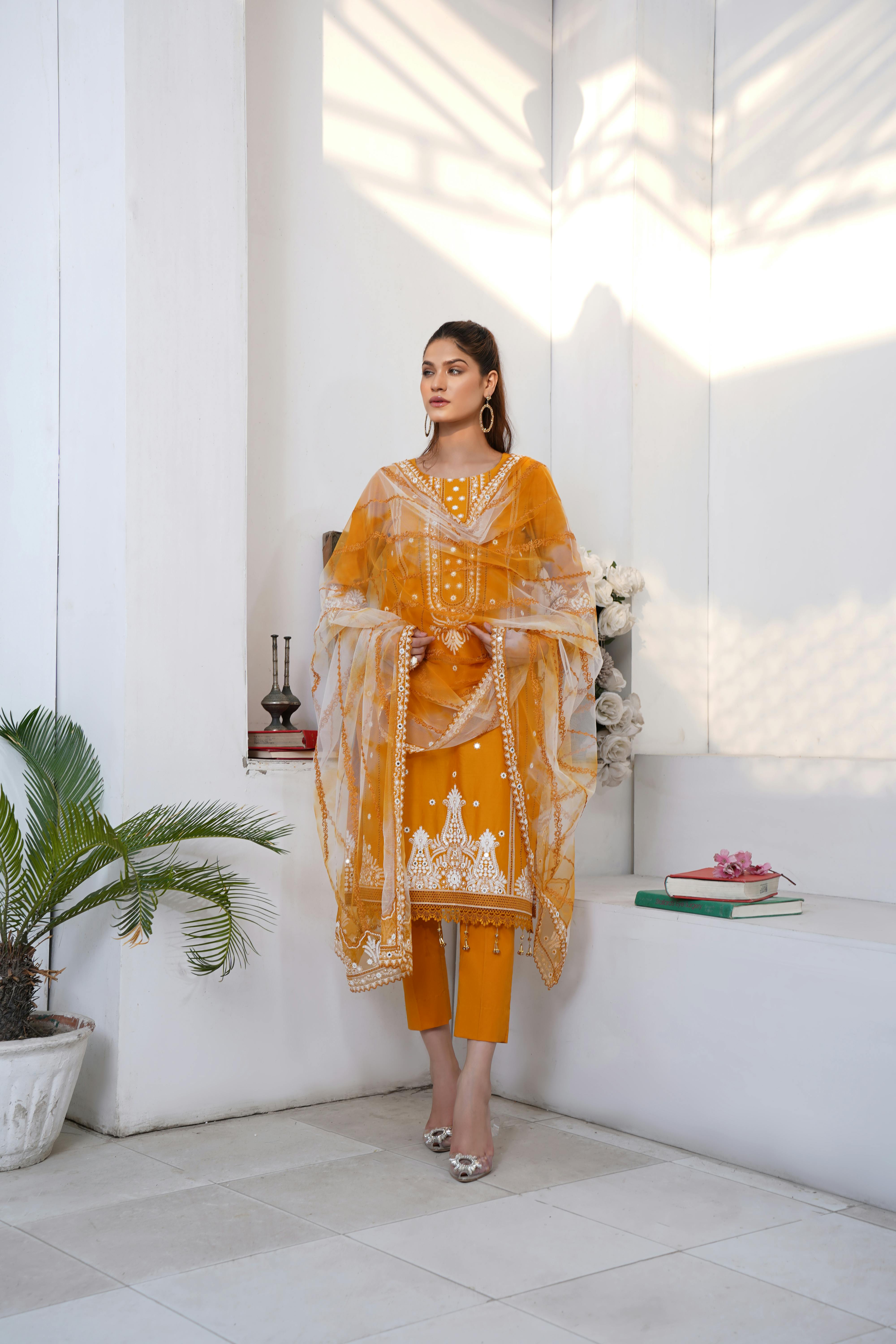 Woman Standing in Yellow Traditional Clothing · Free Stock Photo