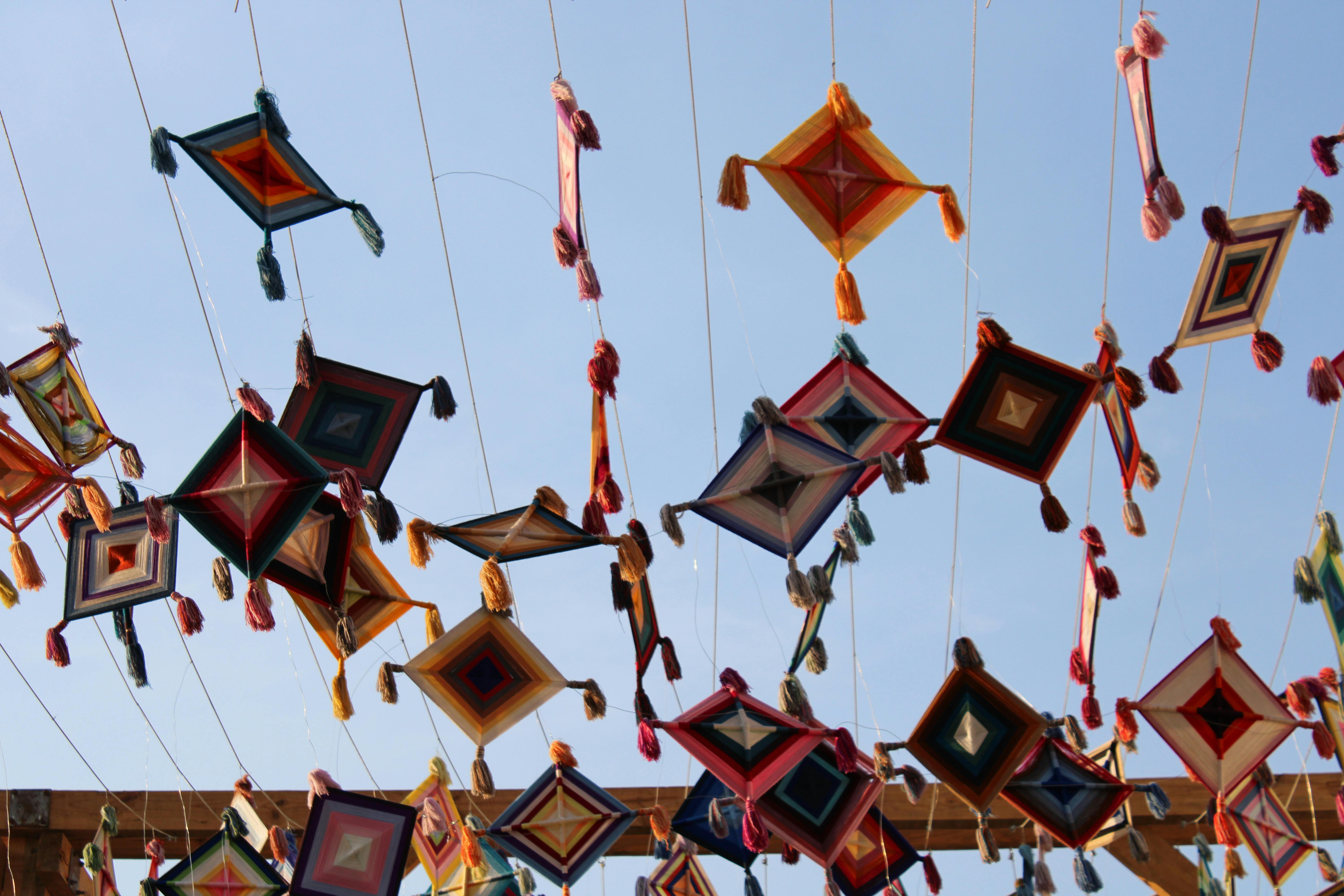 Colorful Traditional Mexican Kites against Blue Sky · Free Stock Photo