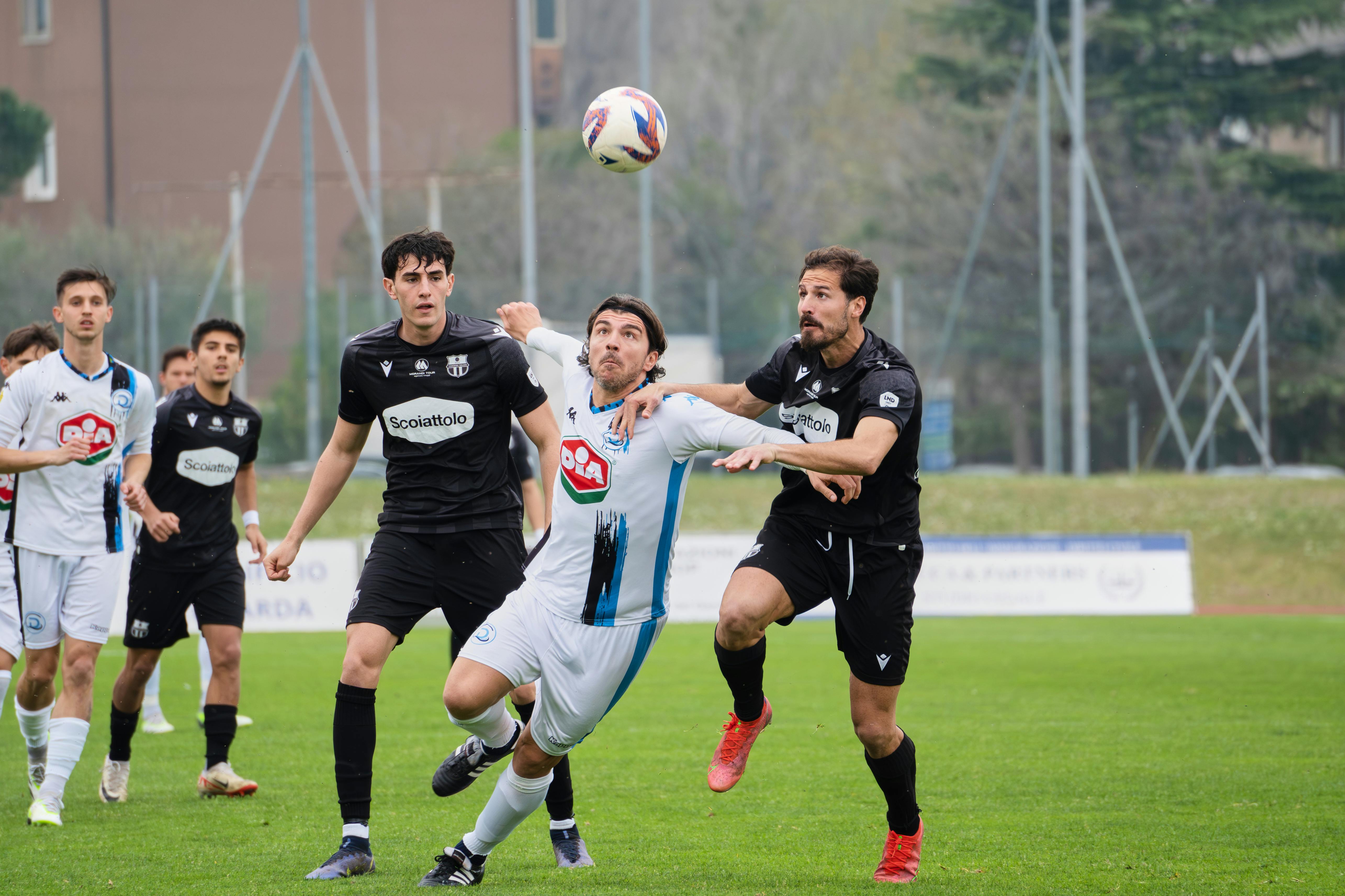 A group of soccer players are playing a game · Free Stock Photo
