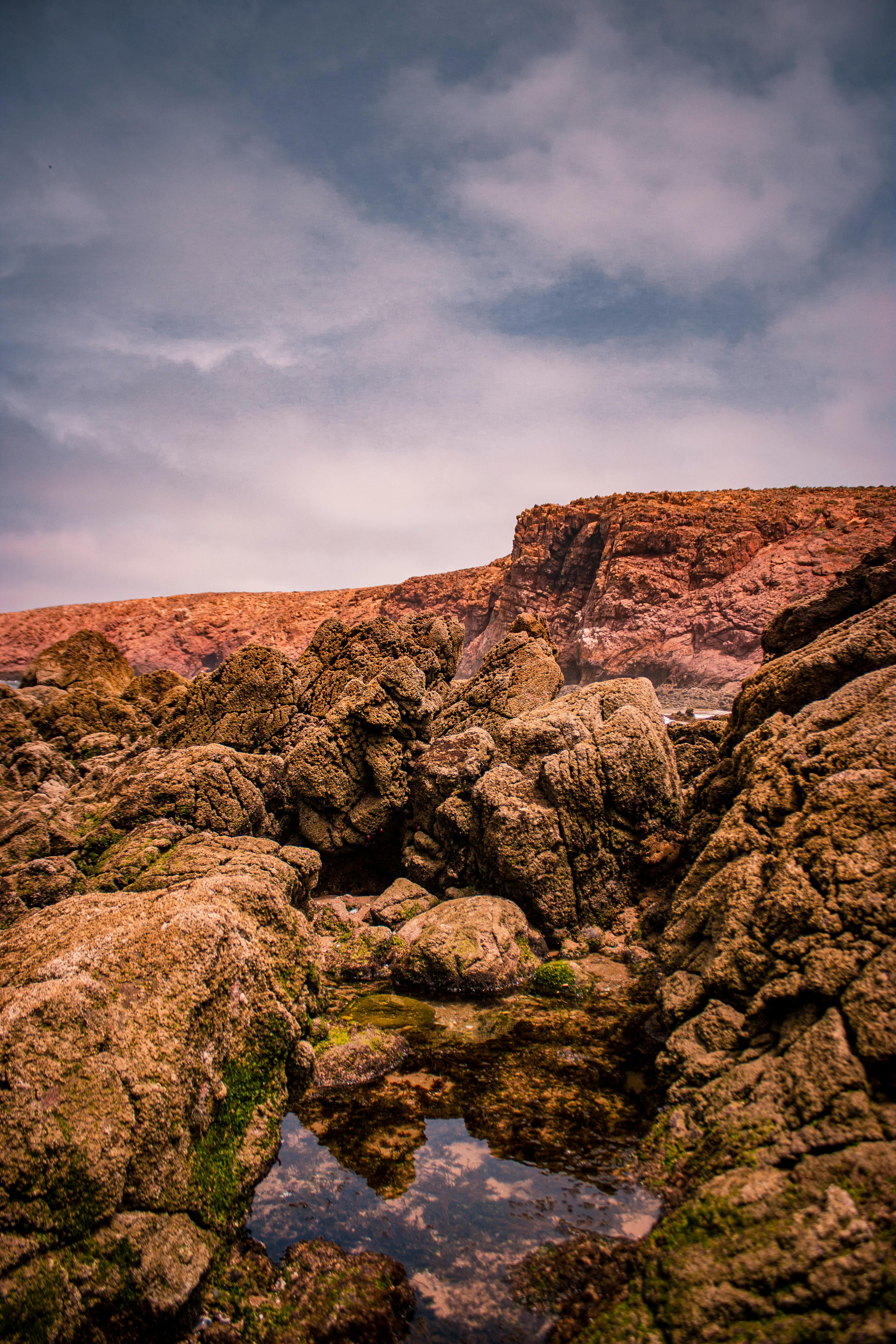 Water Puddle among Barren Rocks · Free Stock Photo