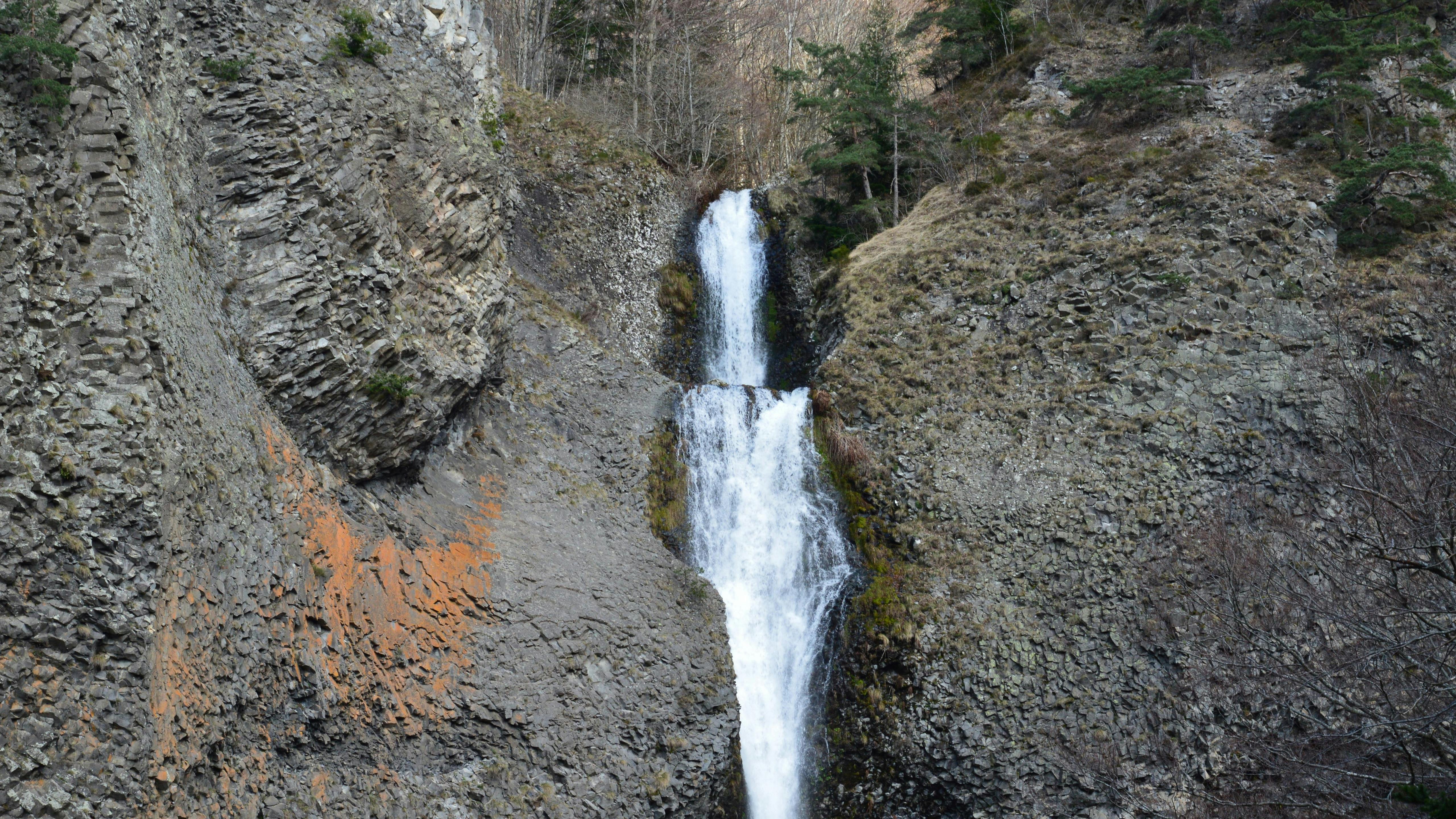 Waterfall and a Rough Cliff · Free Stock Photo