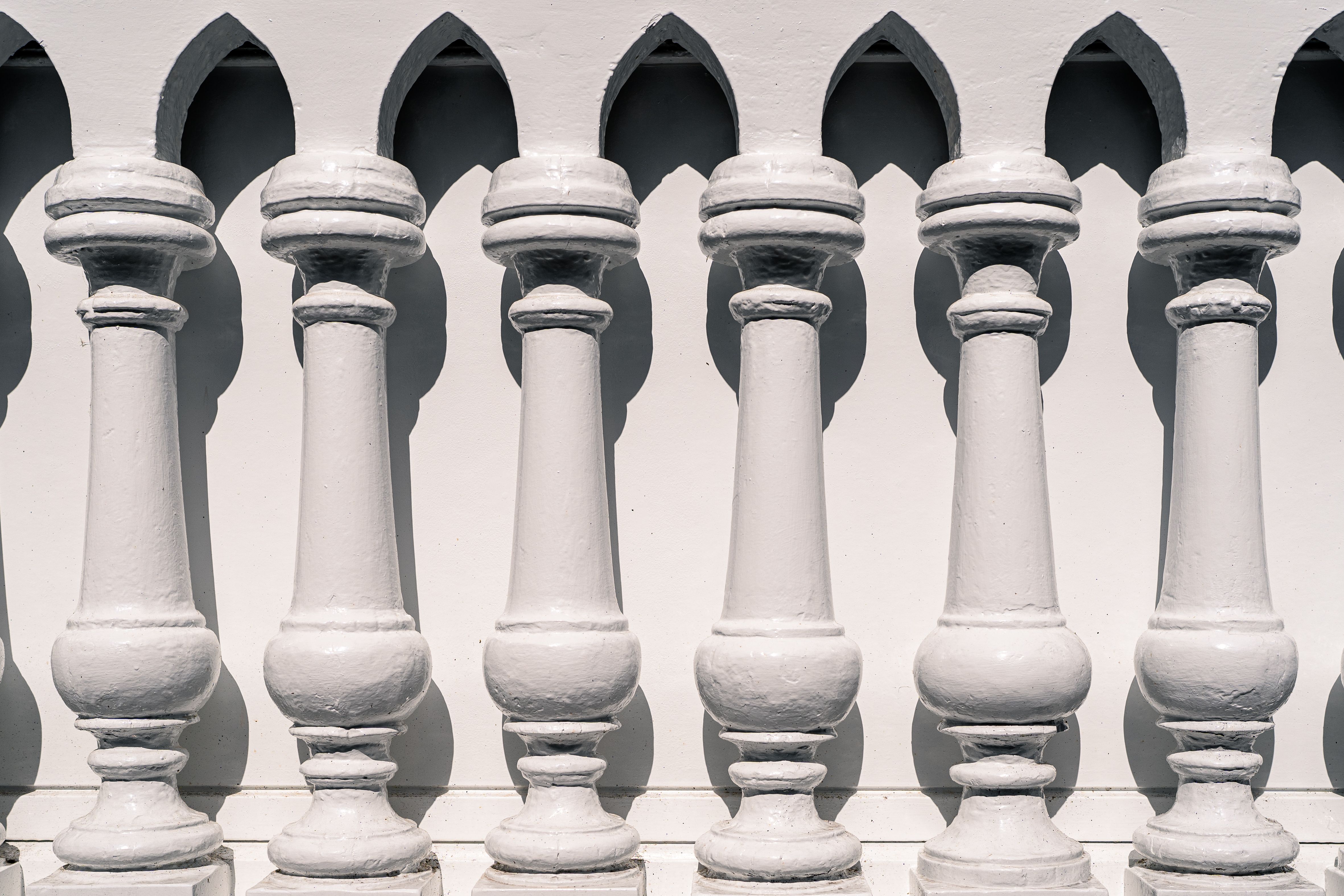 Close-up of a Row of White Columns Outside of a Building · Free Stock Photo