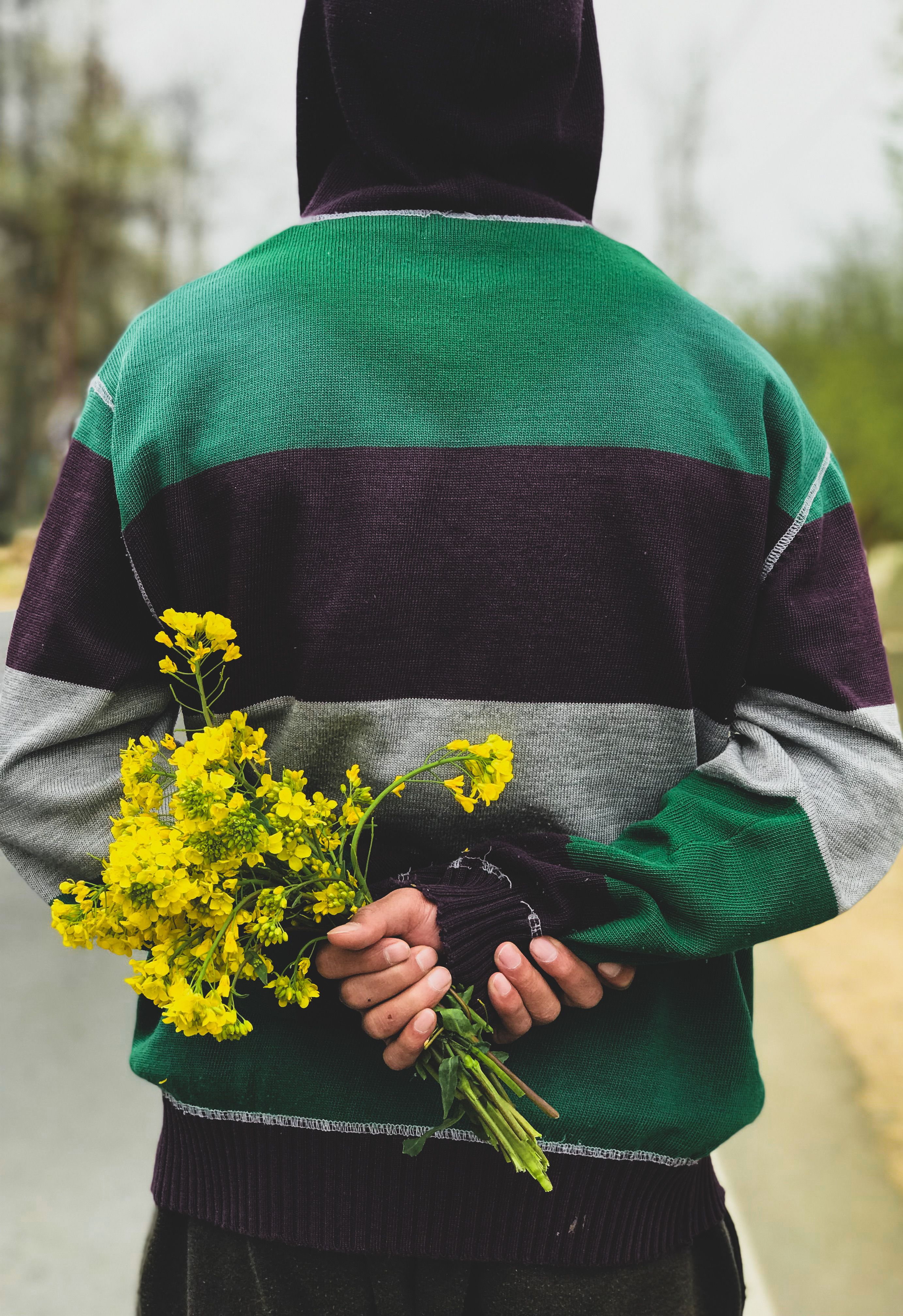 a man having flowers in hand · Free Stock Photo