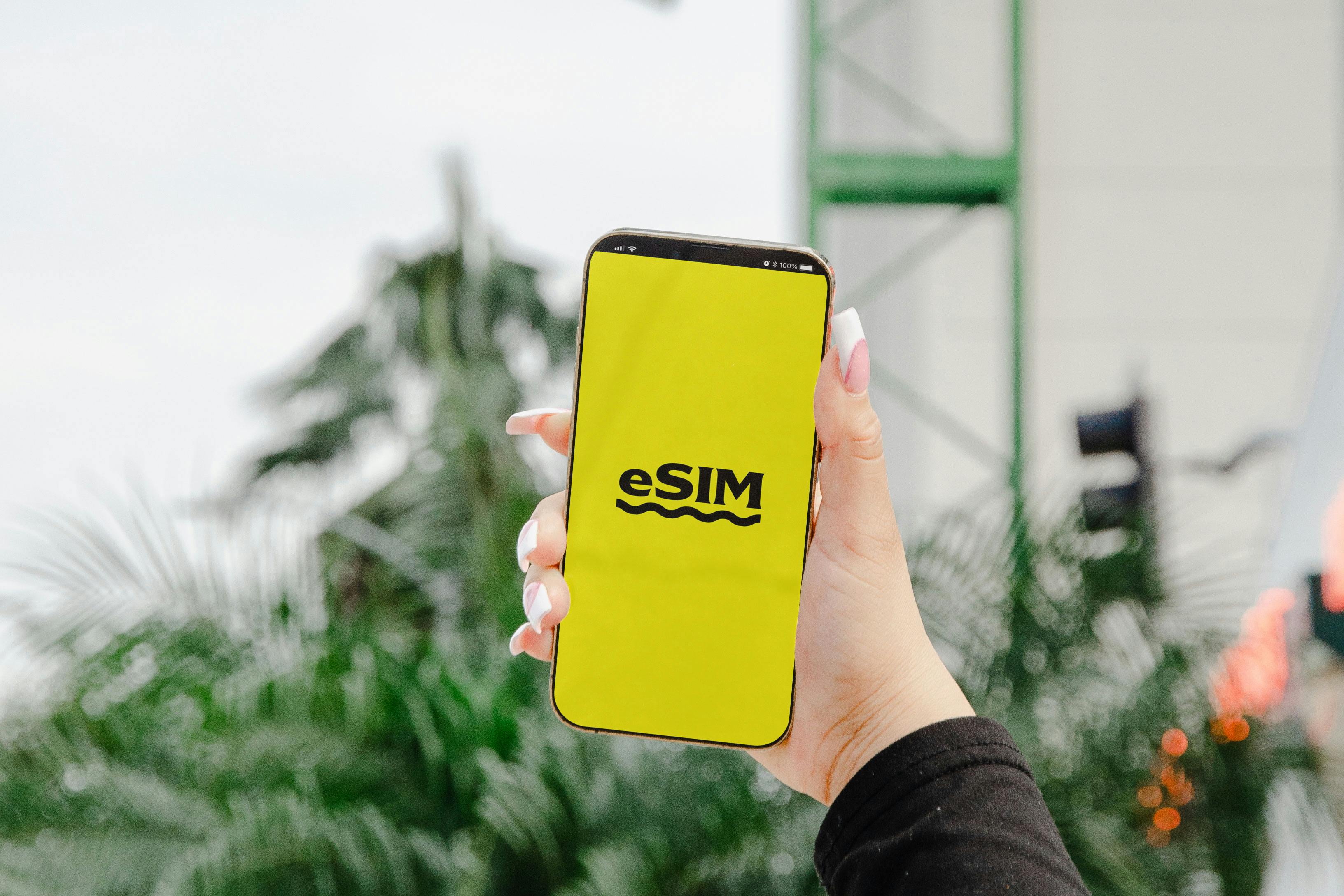 A clear view of a phone with an eSIM logo, emphasizing how eSIMs are ...