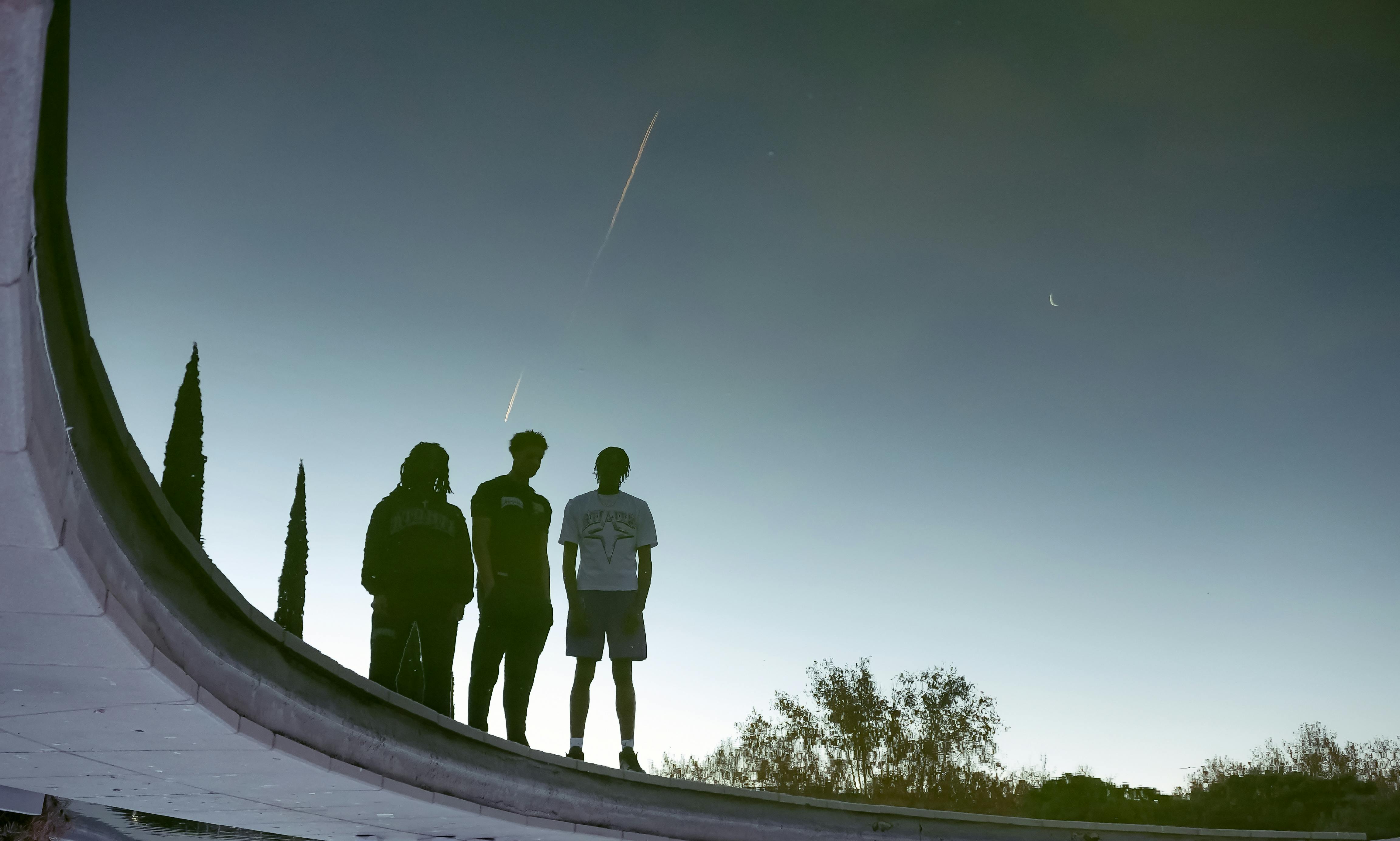 Men Standing over Wall · Free Stock Photo