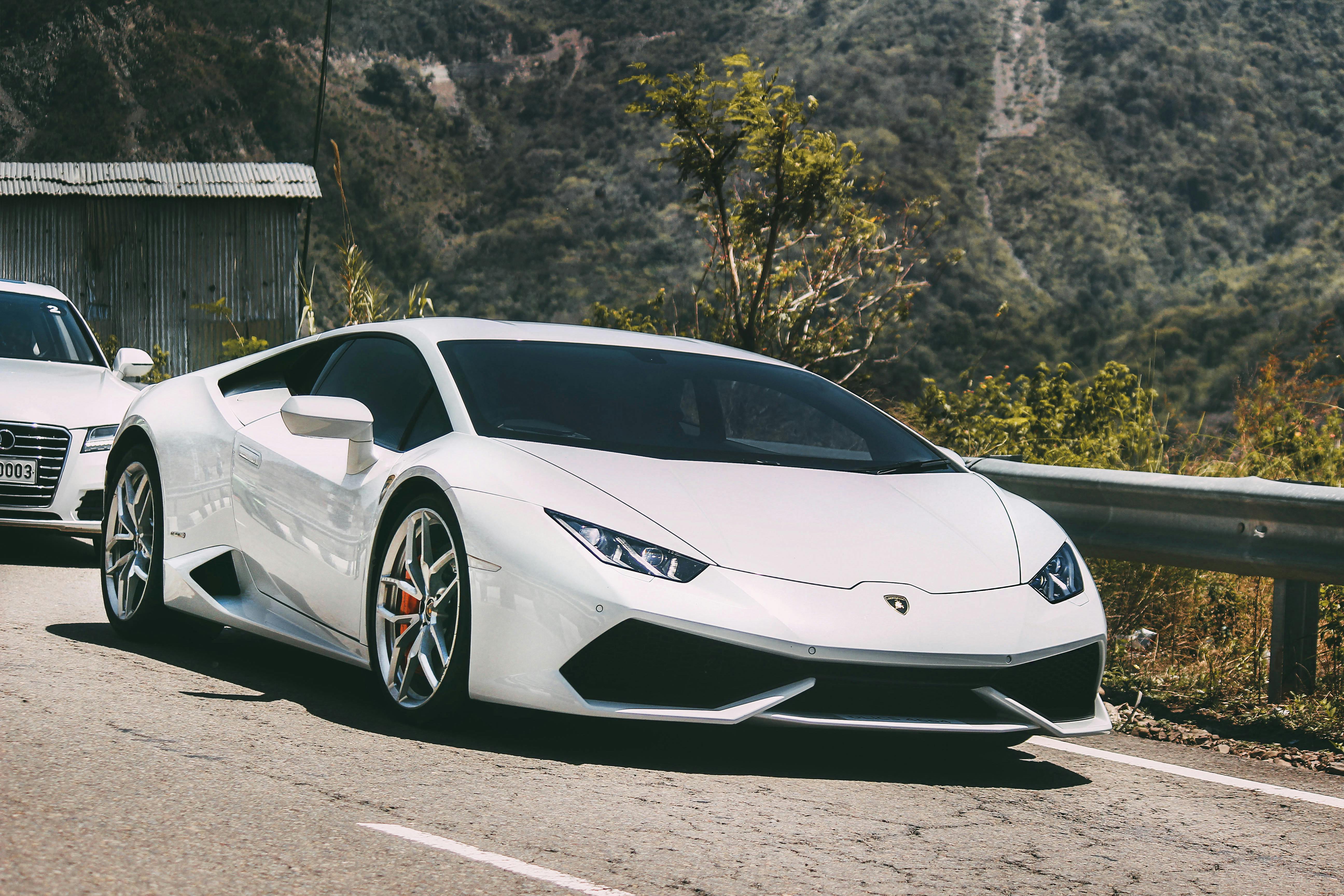 A White Lamborghini Huracan on a Street · Free Stock Photo
