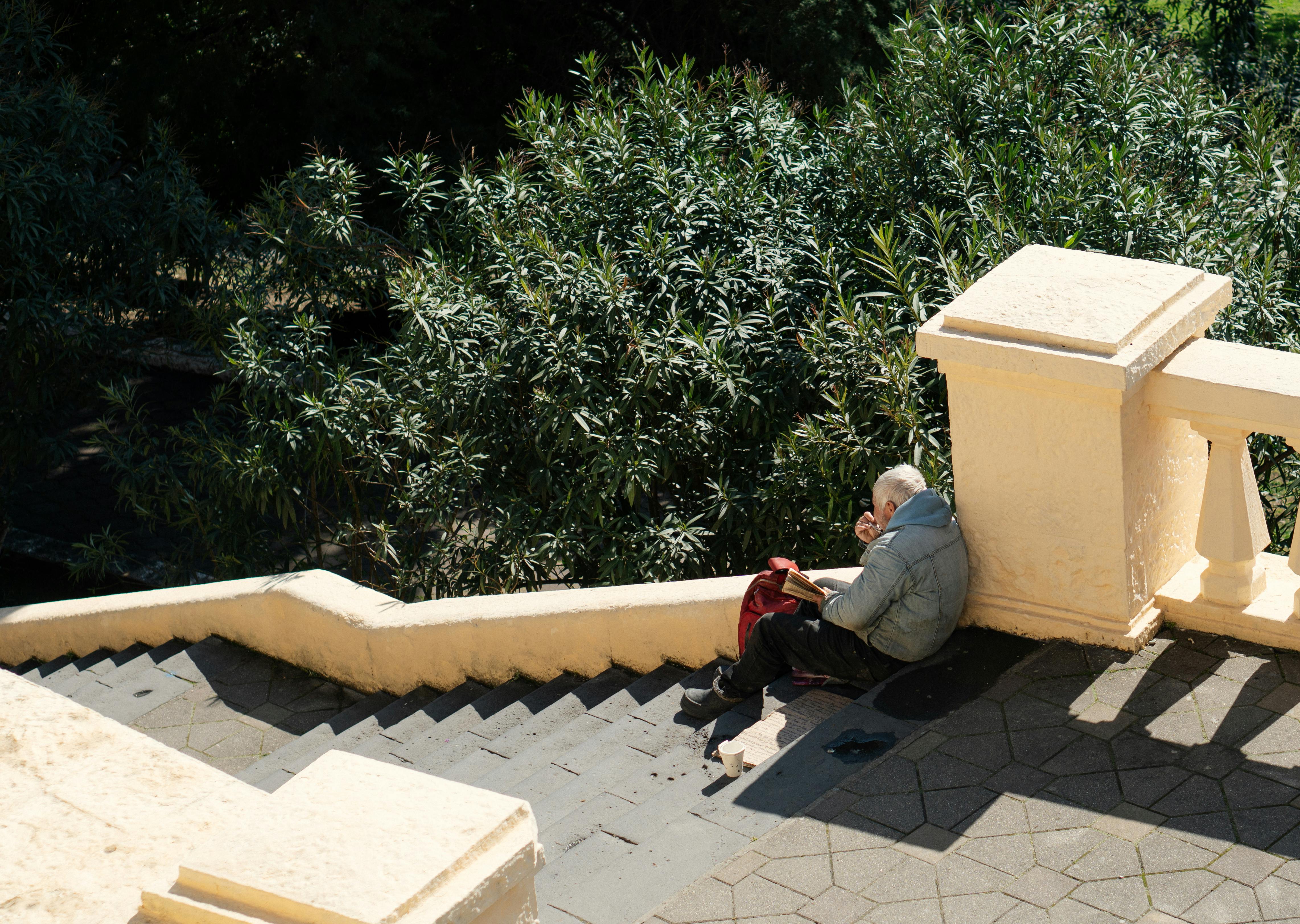 Elderly Man Sitting on Stairs · Free Stock Photo
