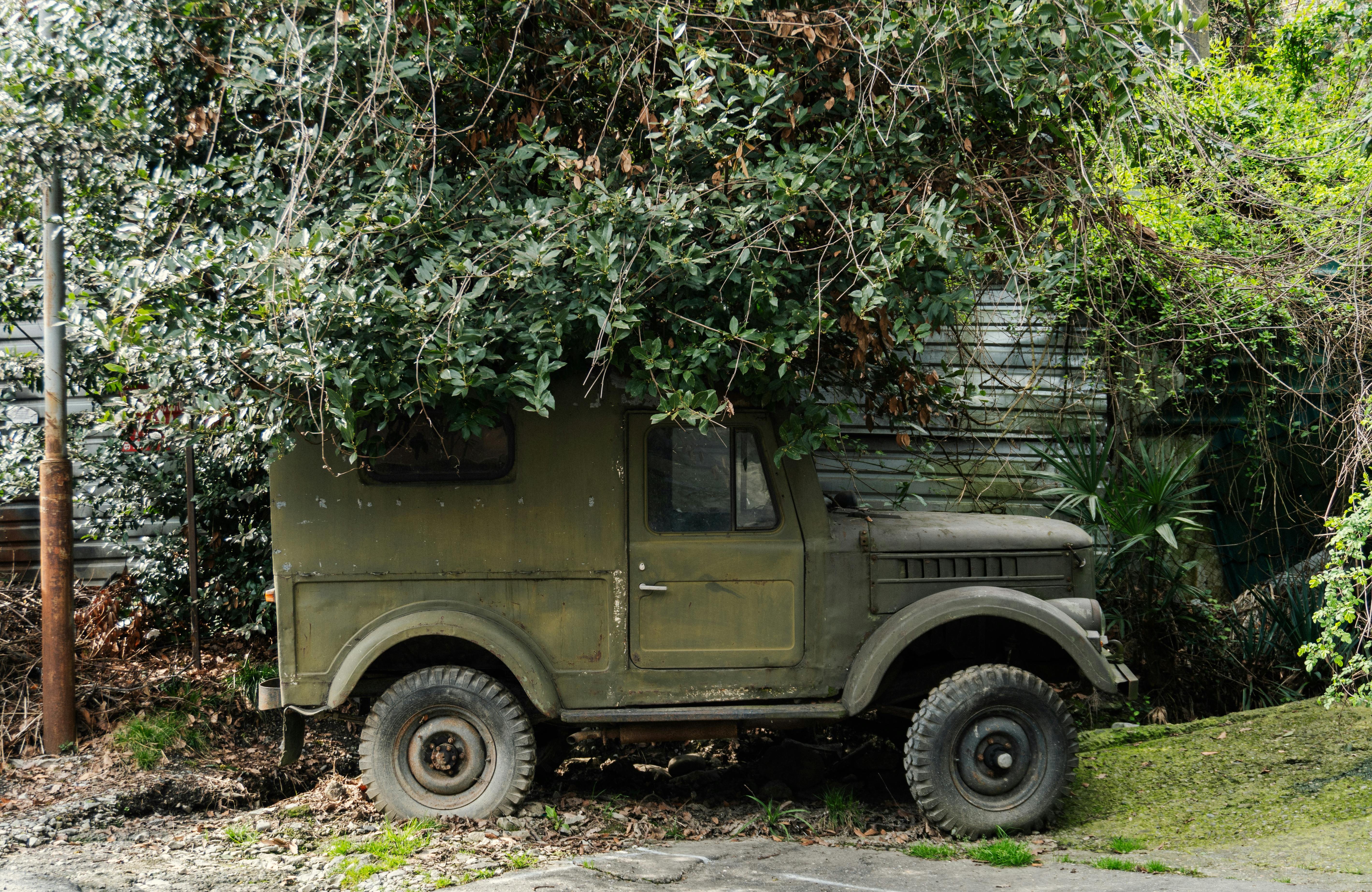 Old GAZ-69 Off-road Vehicle Parked Under a Tree · Free Stock Photo