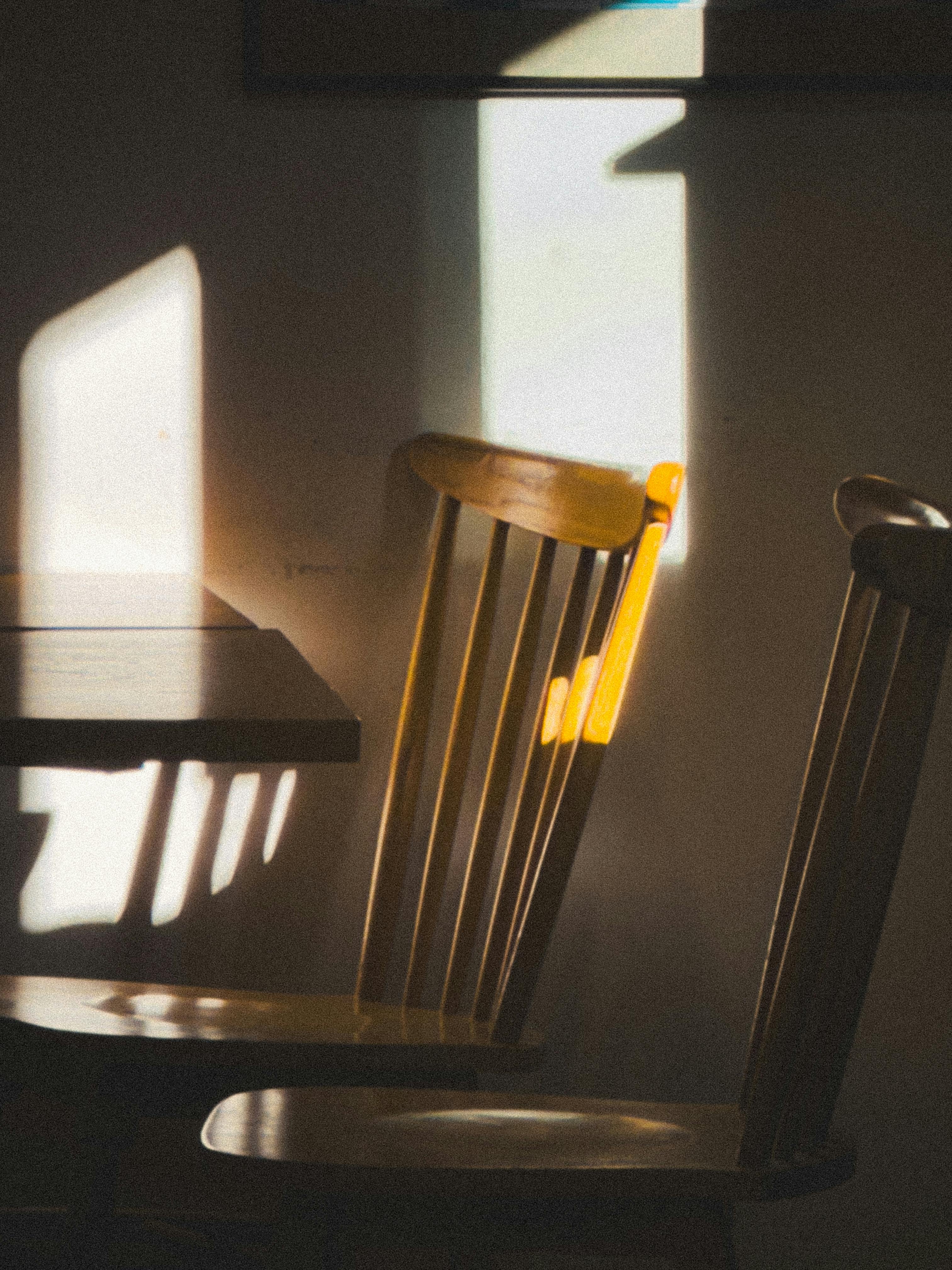 Empty Chair in Light in Room in Shadow · Free Stock Photo